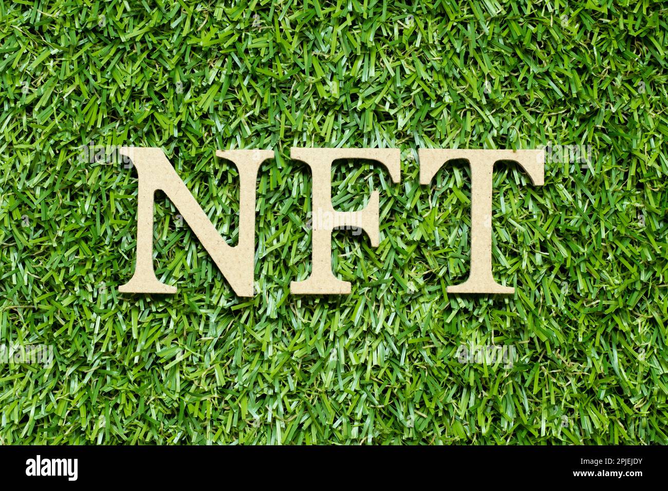 Wood alphabet letter in word NFT (Abbreviation of Non-fungible token ...