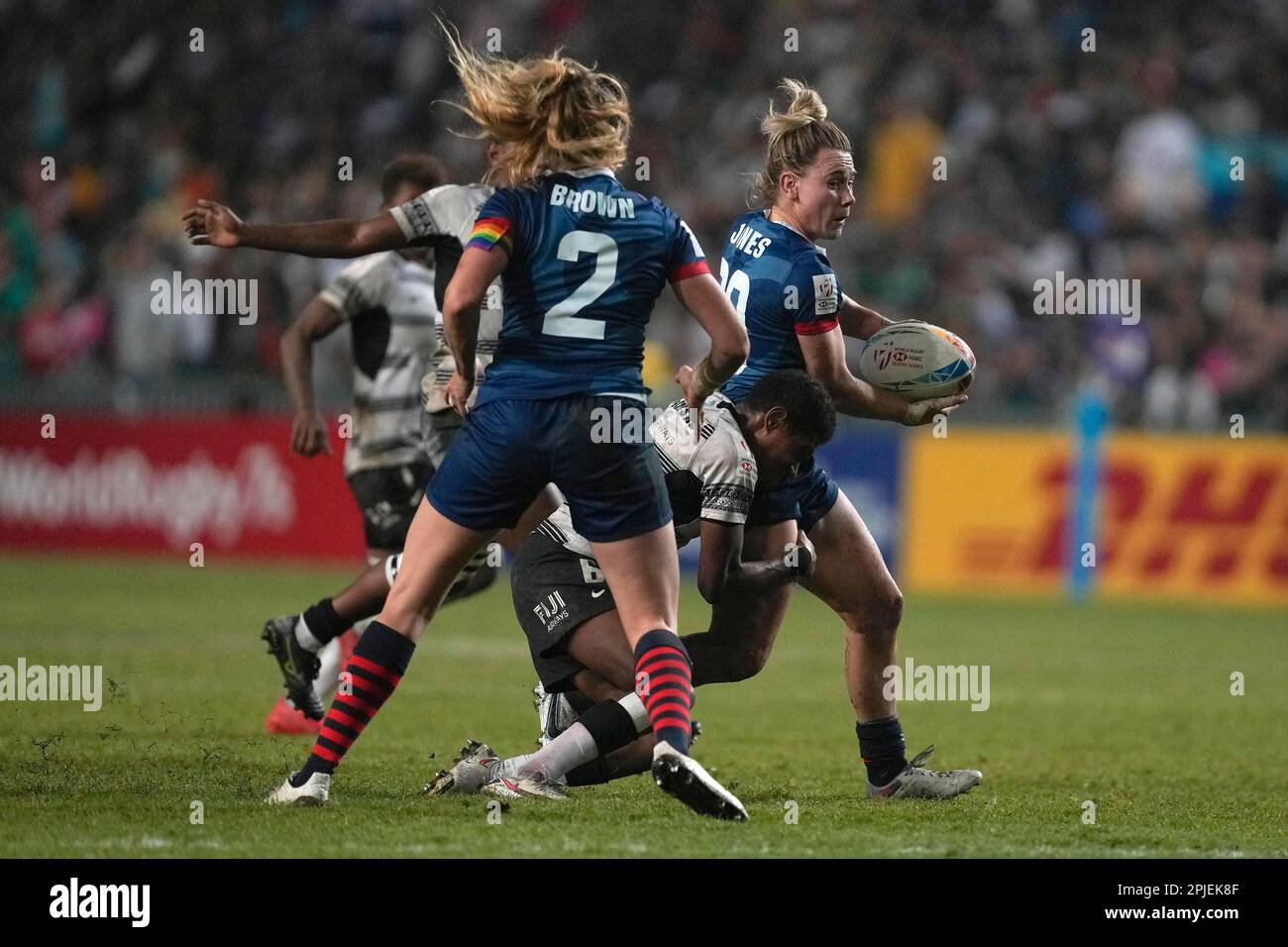 Britain's Megan Jones, right, is tackled by Fiji's Reapi Ulunisau ...