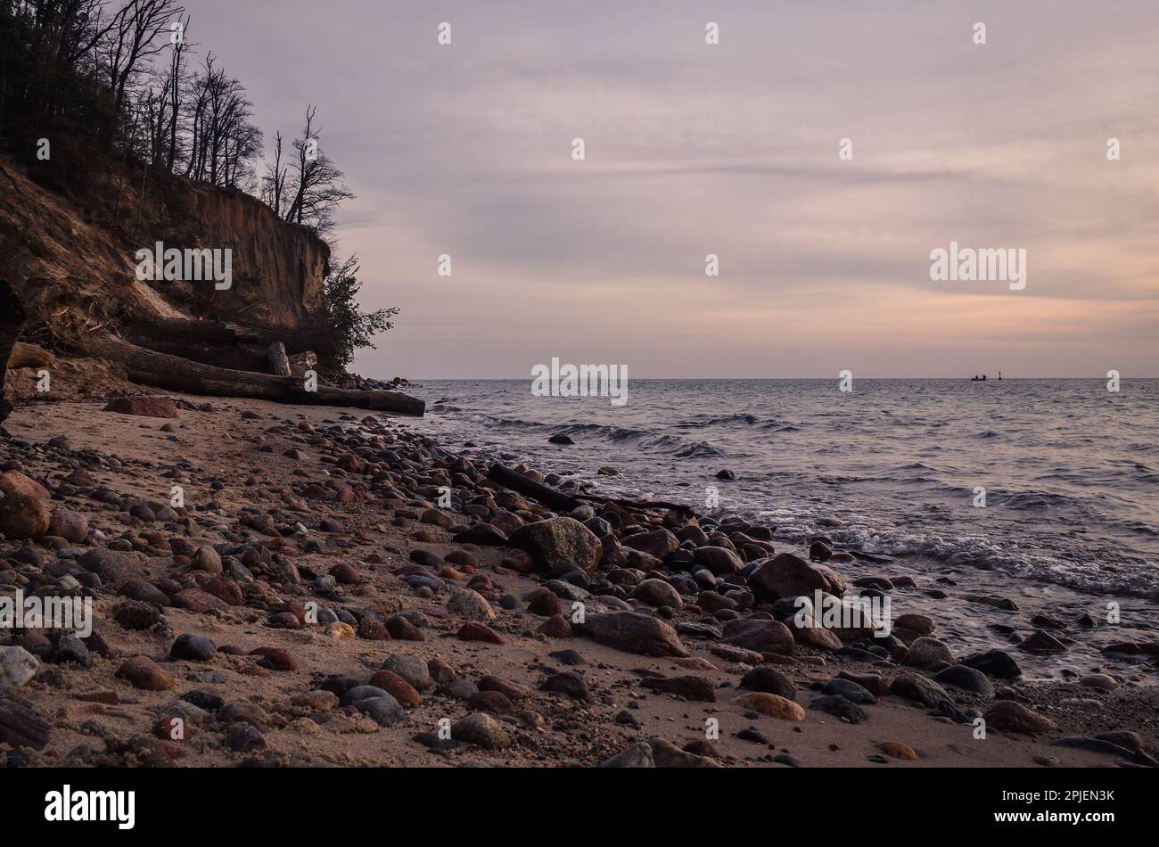 Cloudy winter seaside landscape. Beach with a cliff over the Baltic Sea ...