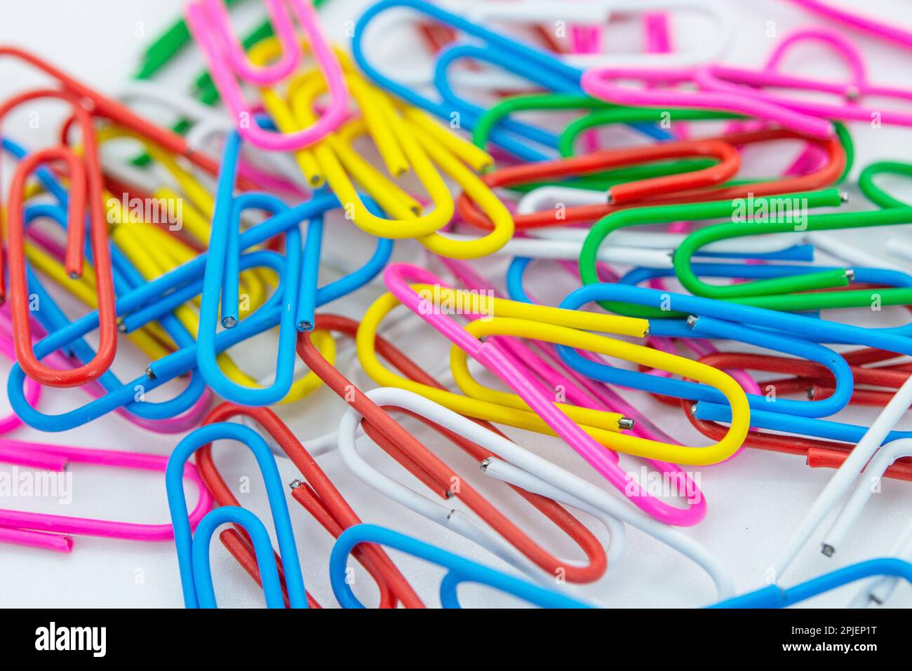 Paper colored clips isolated on white background Stock Photo - Alamy