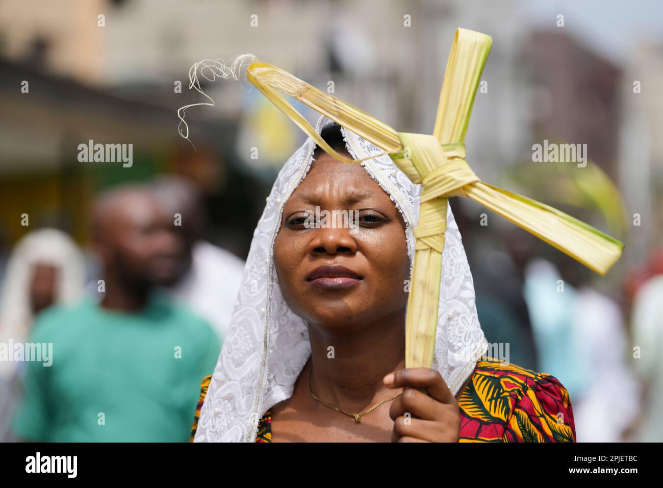 A Catholic faithful marches carrying Palm fronds to commemorate Palm ...