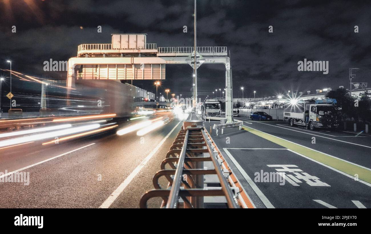Industrial area expressway at night in Tokyo, Japan with traffic ...