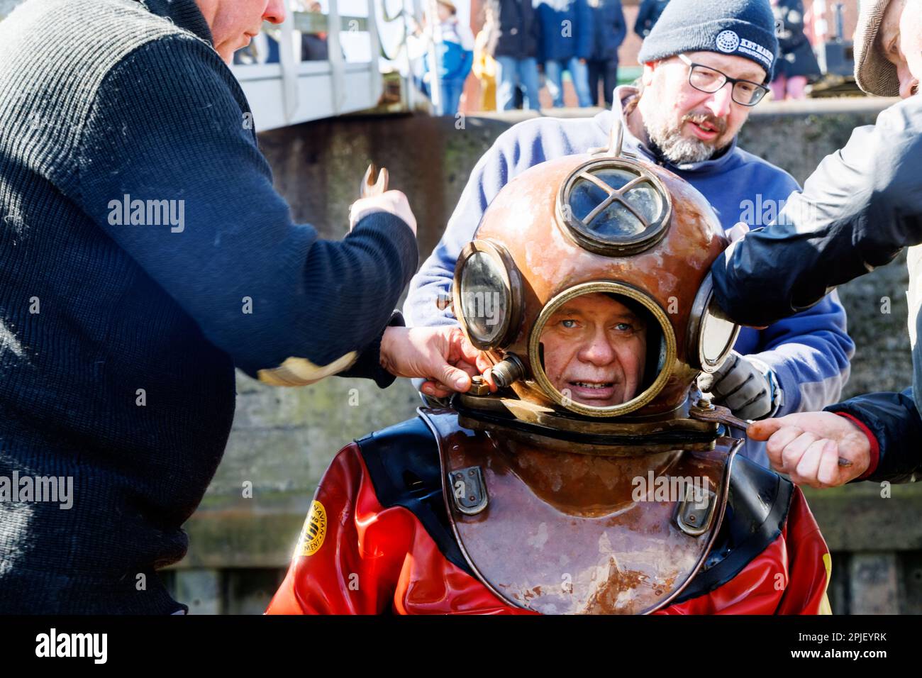 Hamburg, Germany. 02nd Apr, 2023. Three colleagues help museum diver Christian Schuchmann out of ...