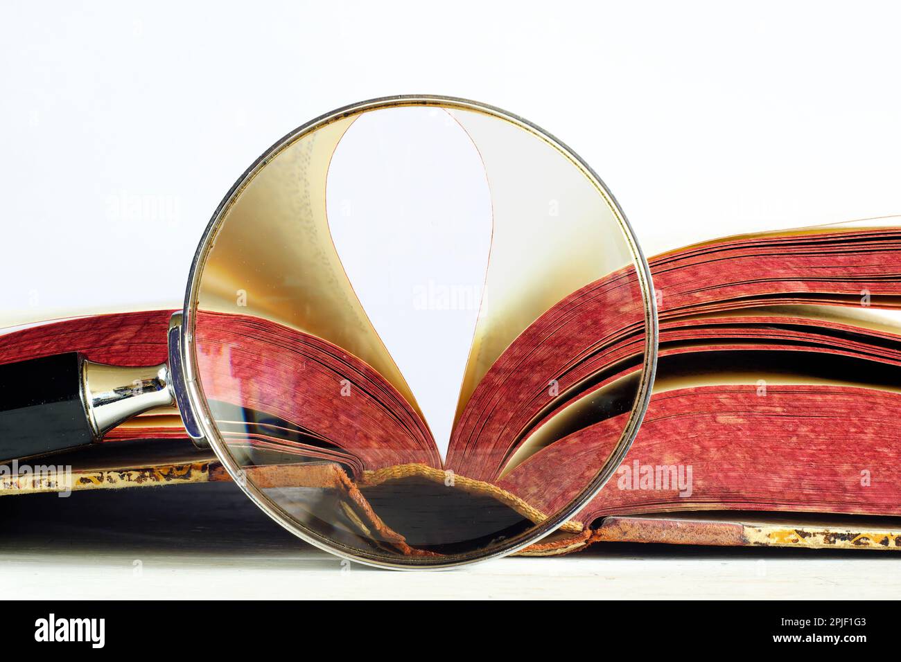 Open book, close up with magnifying glass,reading, education, knowledge ...