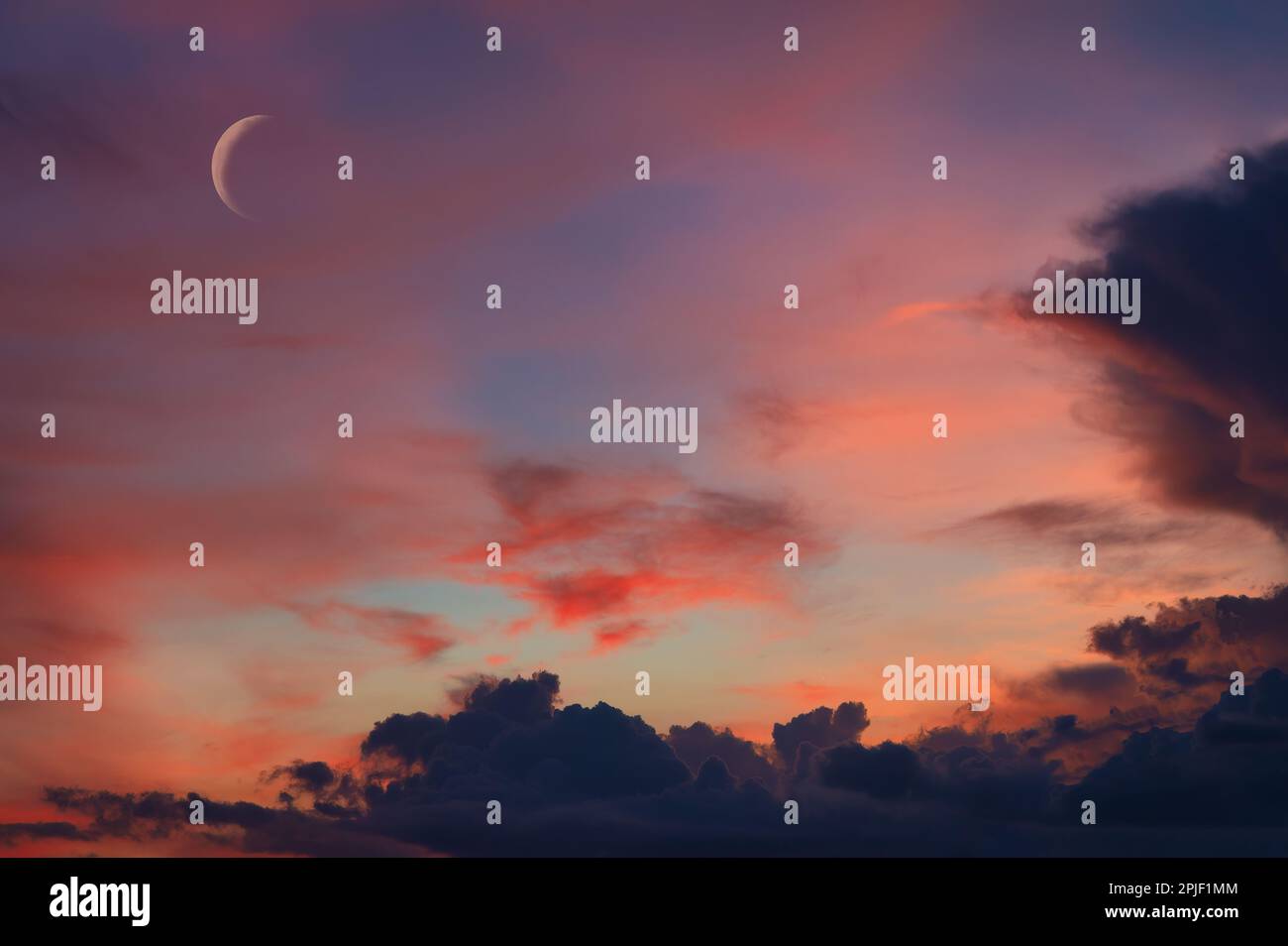 Beautiful colorful sunset sky with clouds and moon in the evening for ...