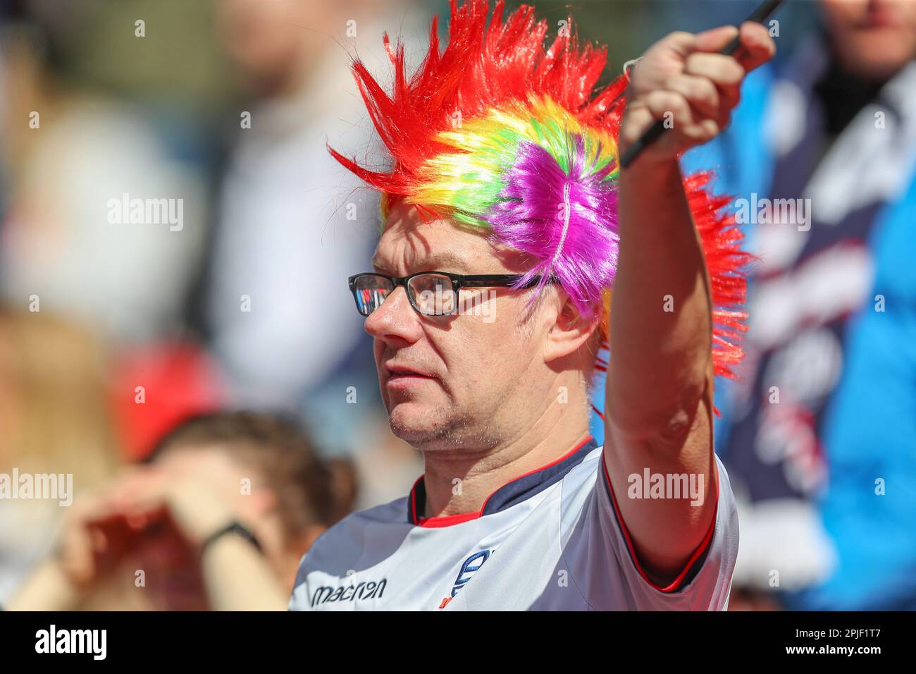 A Bolton Wanderers fan waves a flag during the pre-game warm up ahead ...