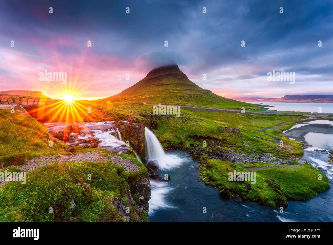 Fantastic landscape of sunset shining over Kirkjufell mountain with ...