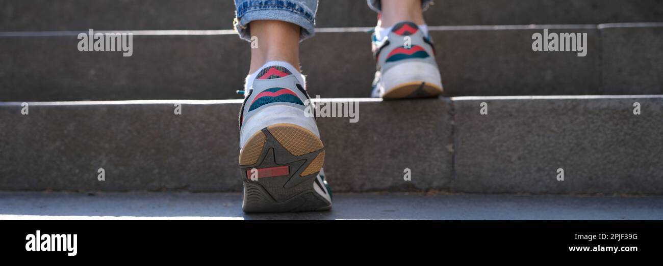Woman walks up stairs outside hi-res stock photography and images - Alamy