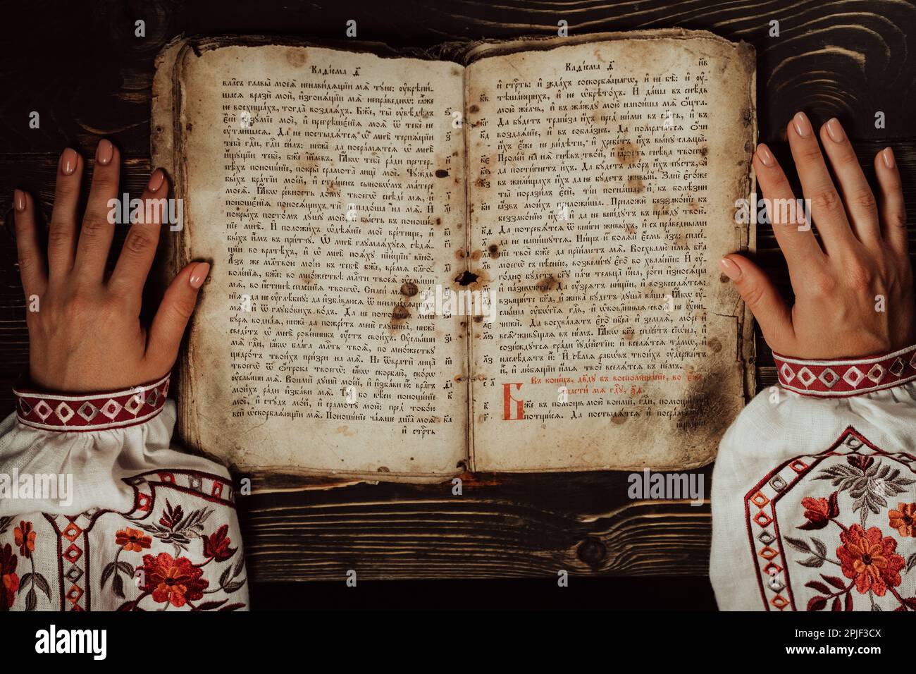 March 2023 - Kyiv, Ukraine. Woman reading ancient book - Bible.Psalter ...