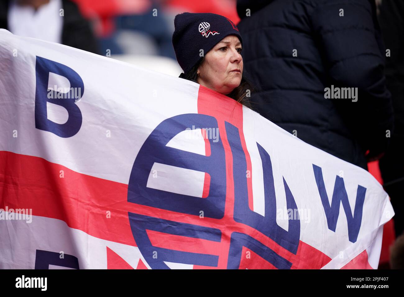 A Bolton Wanderers fan with a large flag seen ahead of the Papa Johns ...