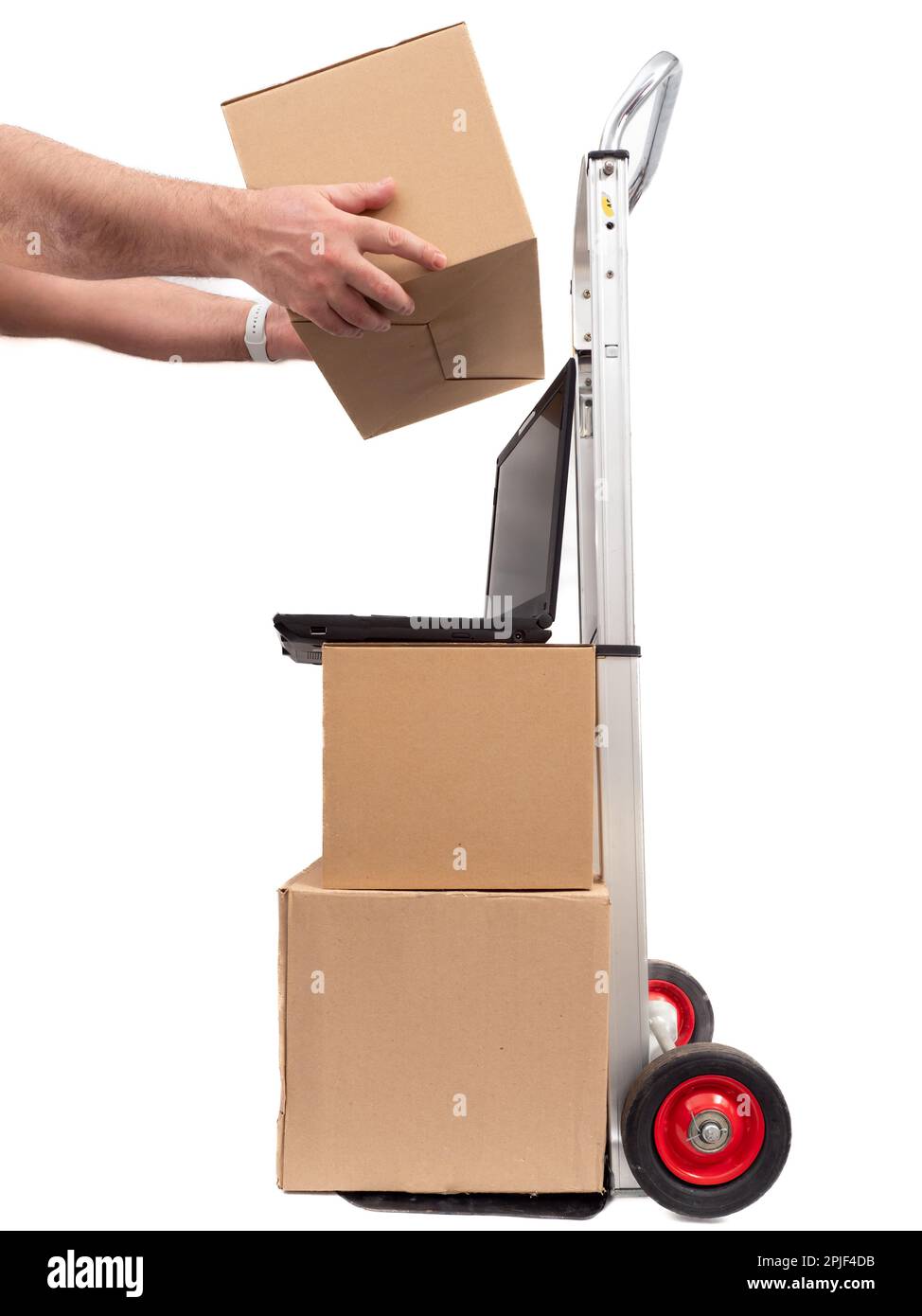 Cardboard boxes with a trolley and a laptop on a white background ...