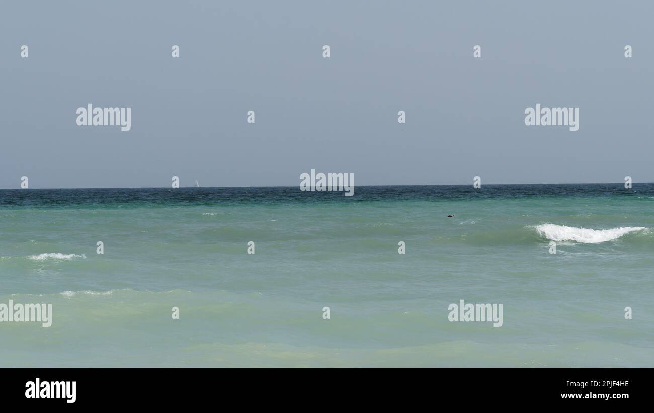 Gentle surf on a late afternoon Stock Photo - Alamy