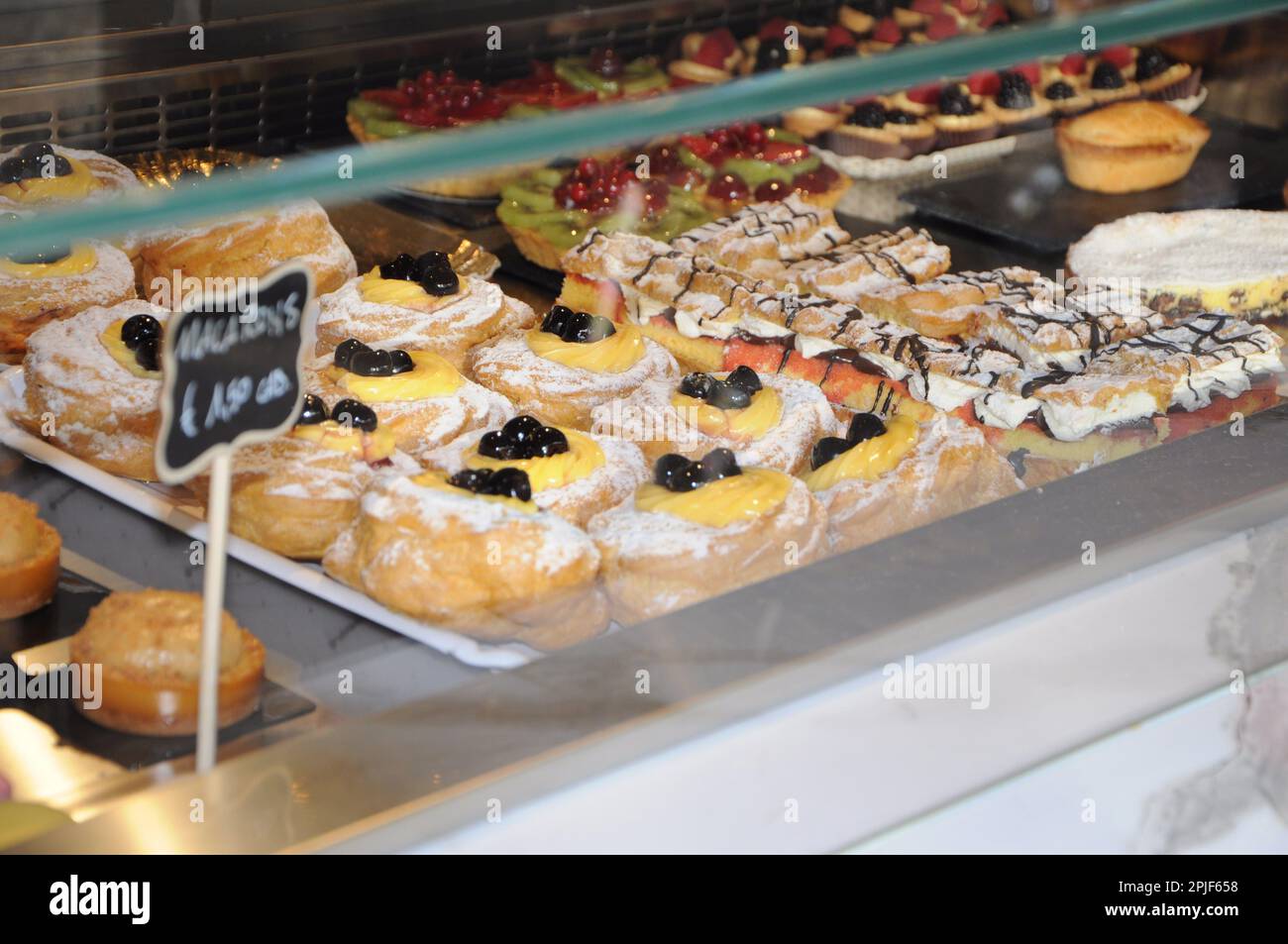 Patisserie display cakes artisanal bakery in italy bar Stock Photo - Alamy