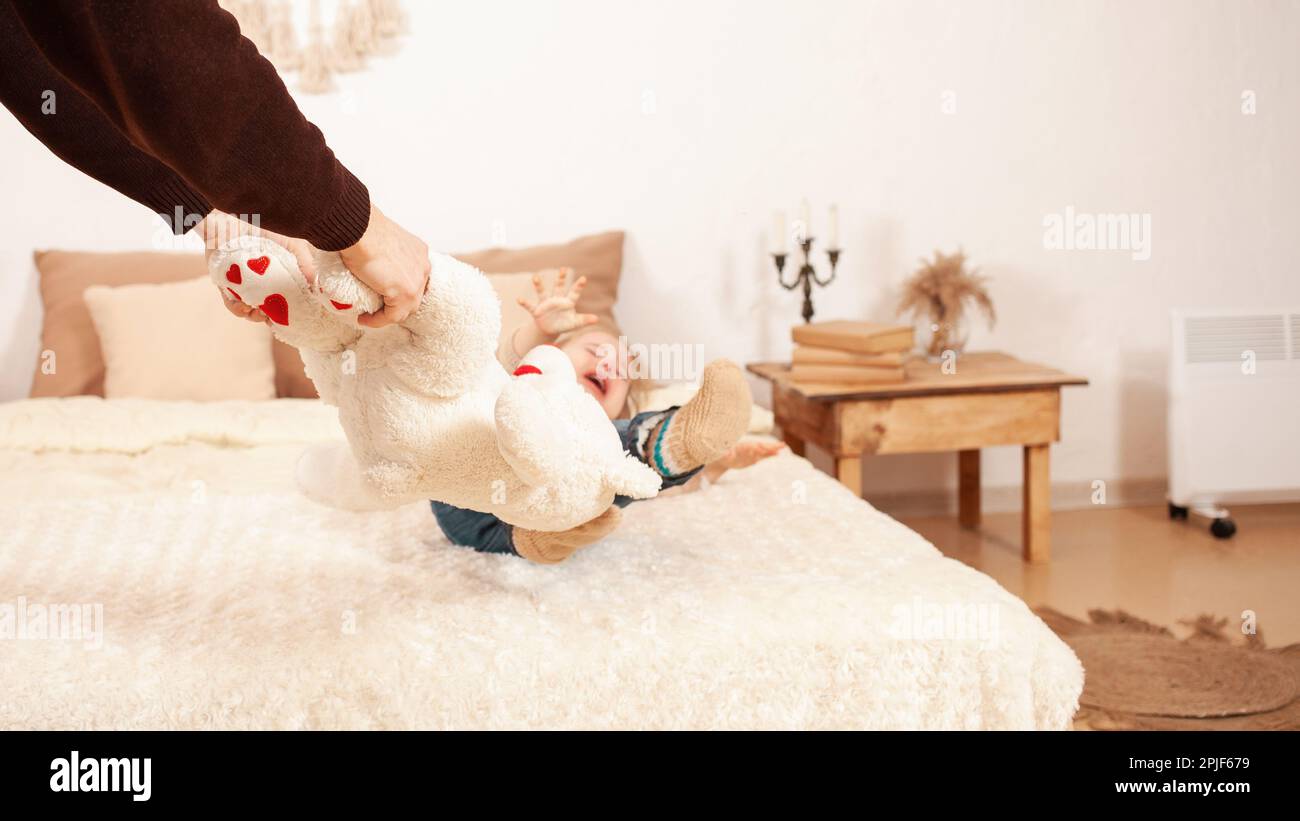 The child does not want to share toys, cries screaming hysterical. A ...