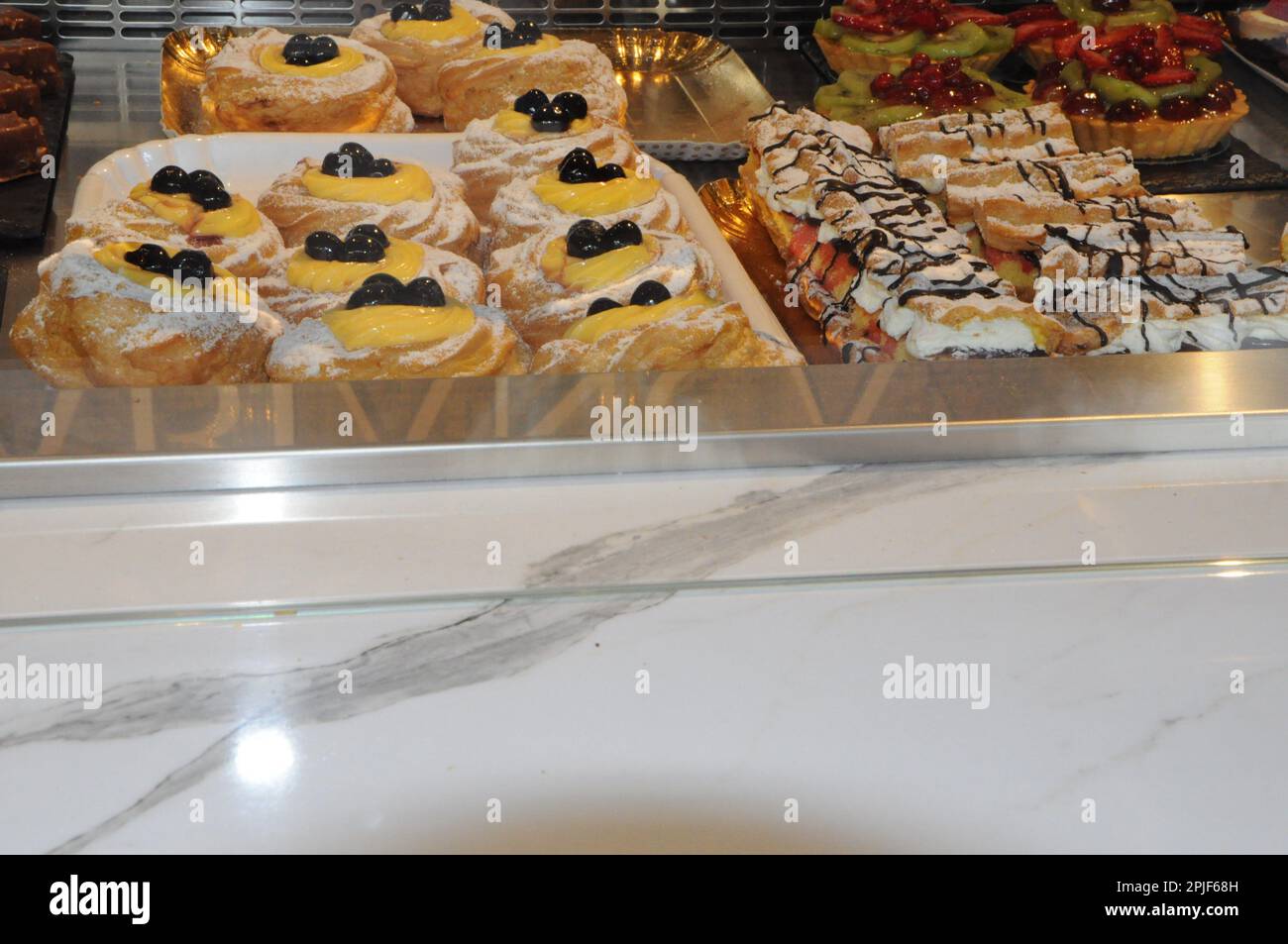 Patisserie display cakes artisanal bakery in italy bar Stock Photo - Alamy