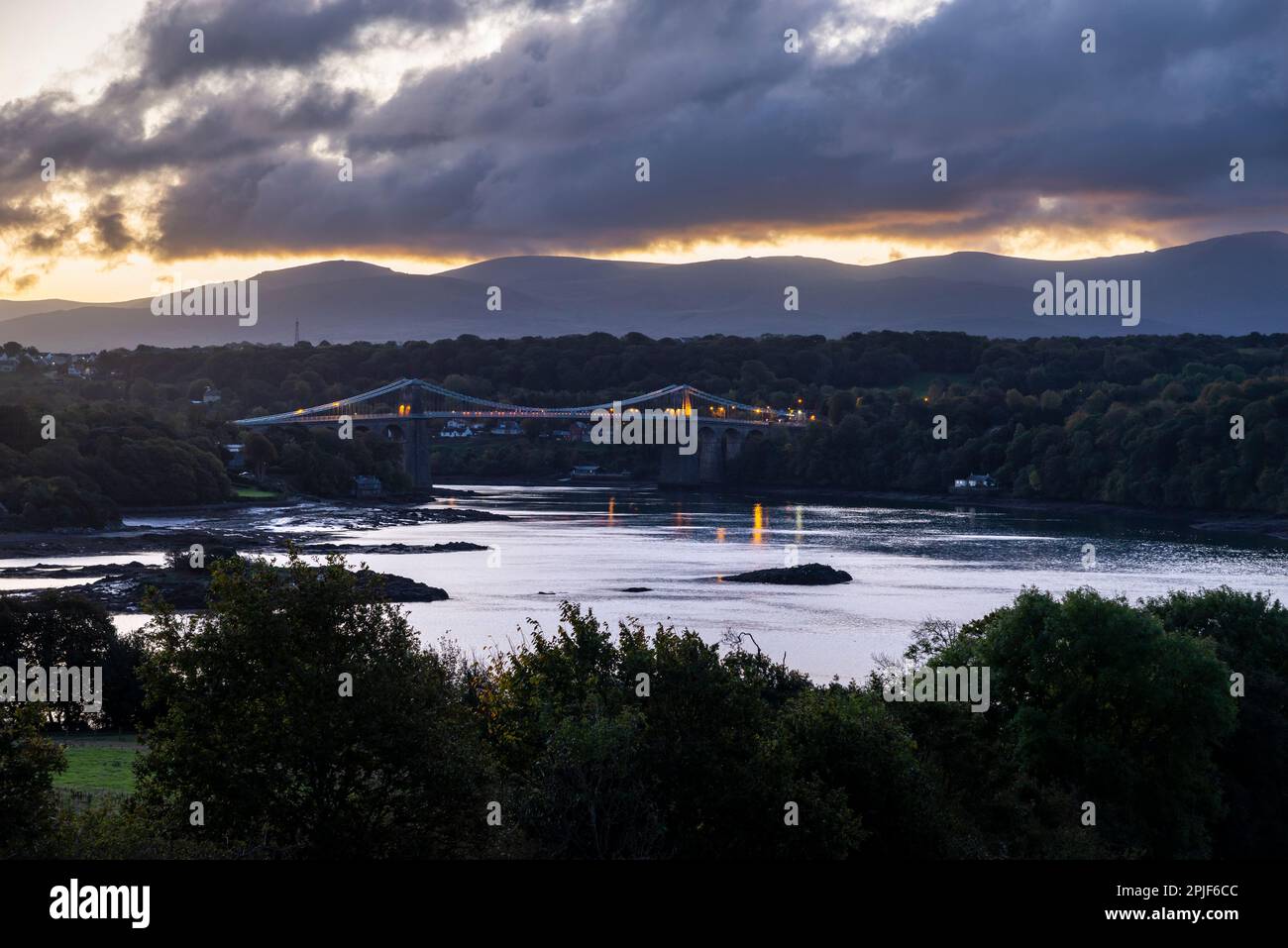 Menai Bridge, Anglesey, North Wales at dusk in mid October. A famous ...