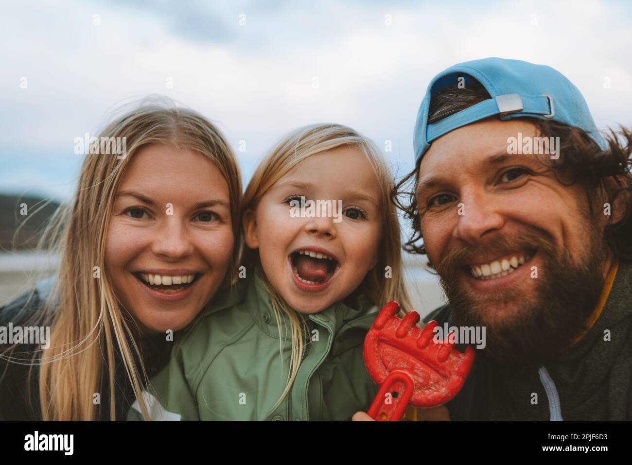 Family selfie parents with child outdoor mother and father with ...