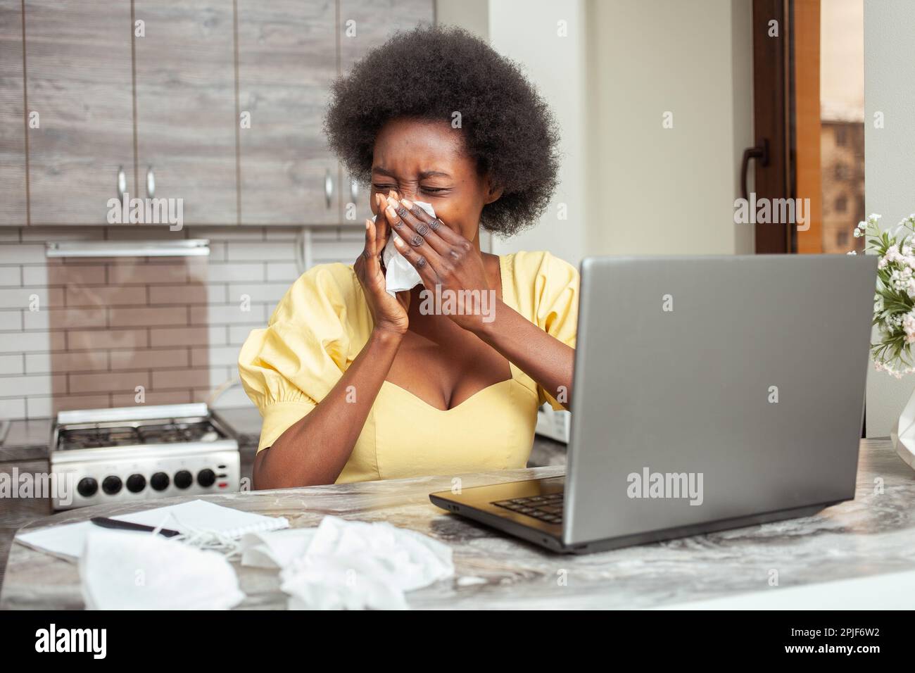 Woman sick sneezes desk hi-res stock photography and images - Alamy