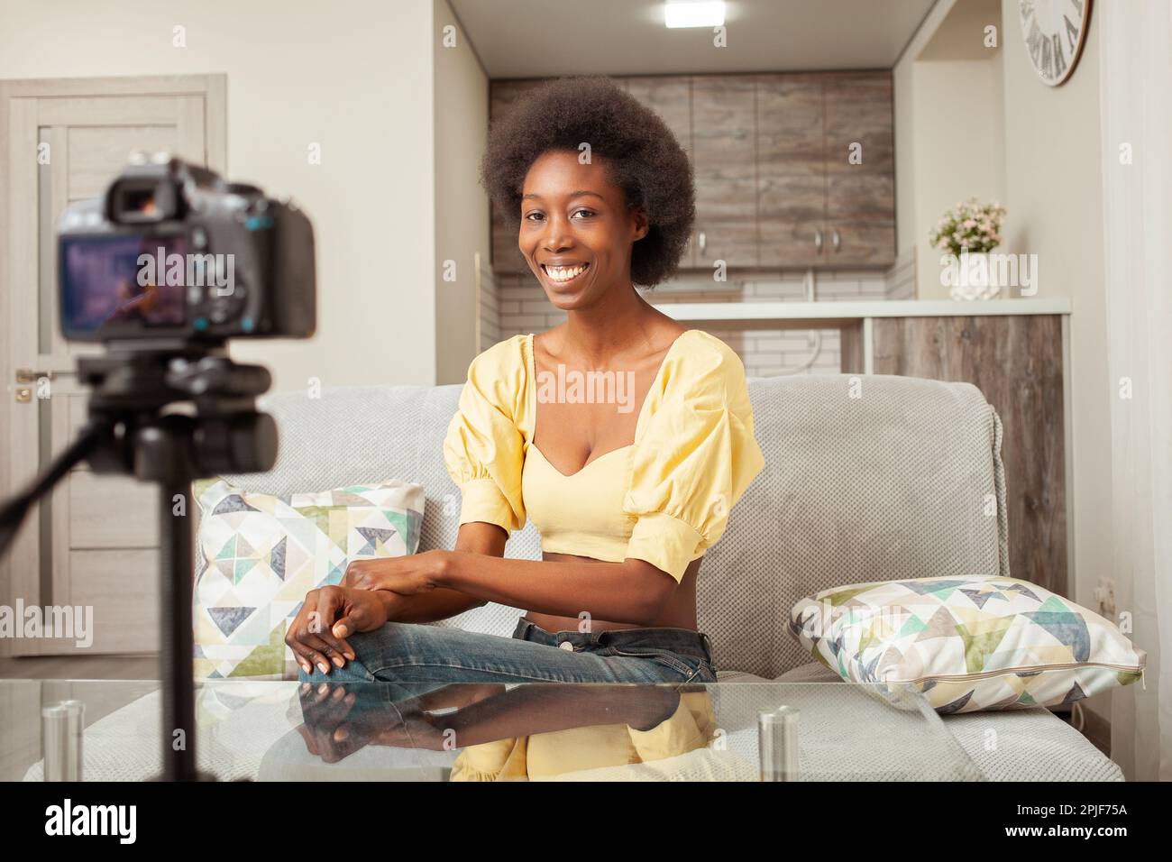An African American black woman blogger records video on channel ...