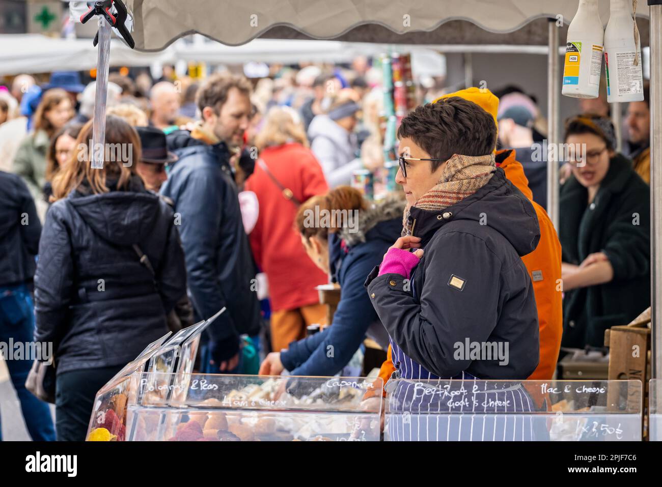 Close up of female food stall vendor at Frome Sunday Market, Somerset ...