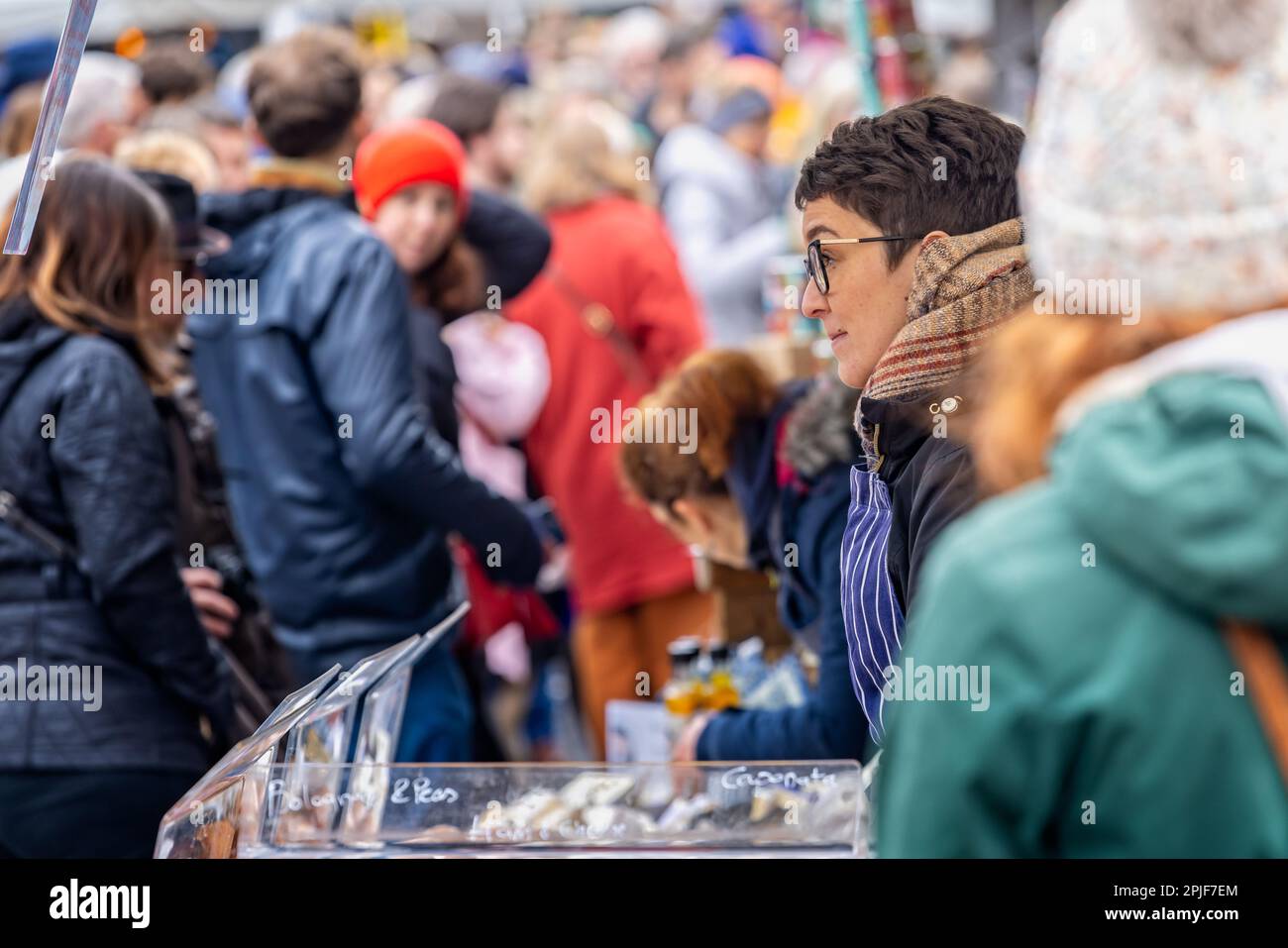 Close up of female food stall vendor at Frome Sunday Market, Somerset ...