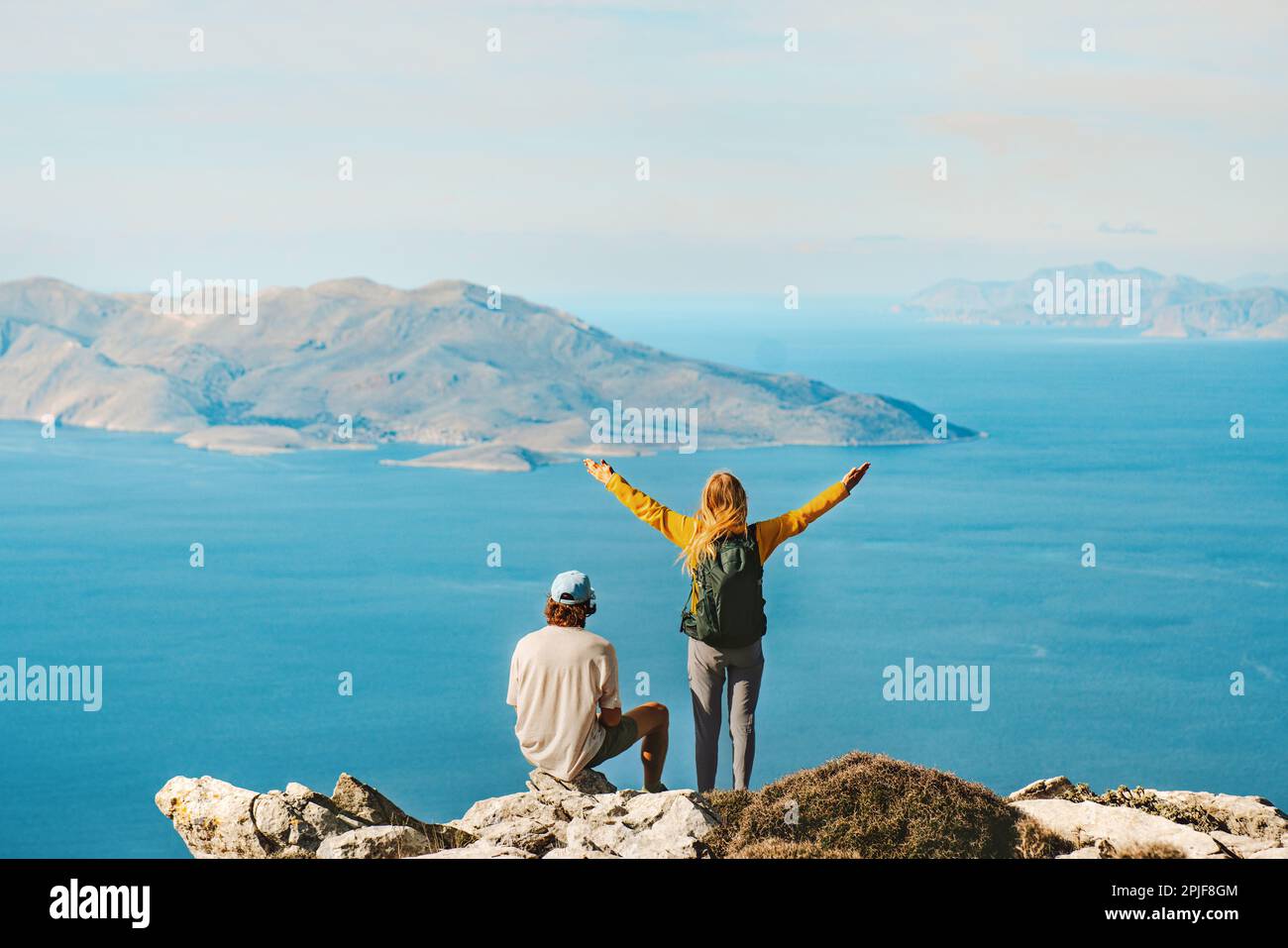 Couple travelers hiking in Greece together outdoor travel lifestyle ...