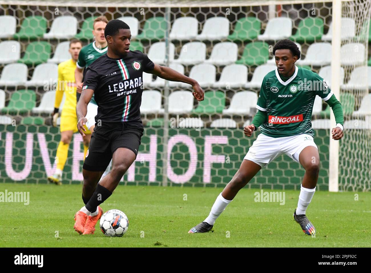 Lommel, Belgium. 02nd Apr, 2023. Virton's Keres Masangu and Lommel's Amar Fatah pictured in ...