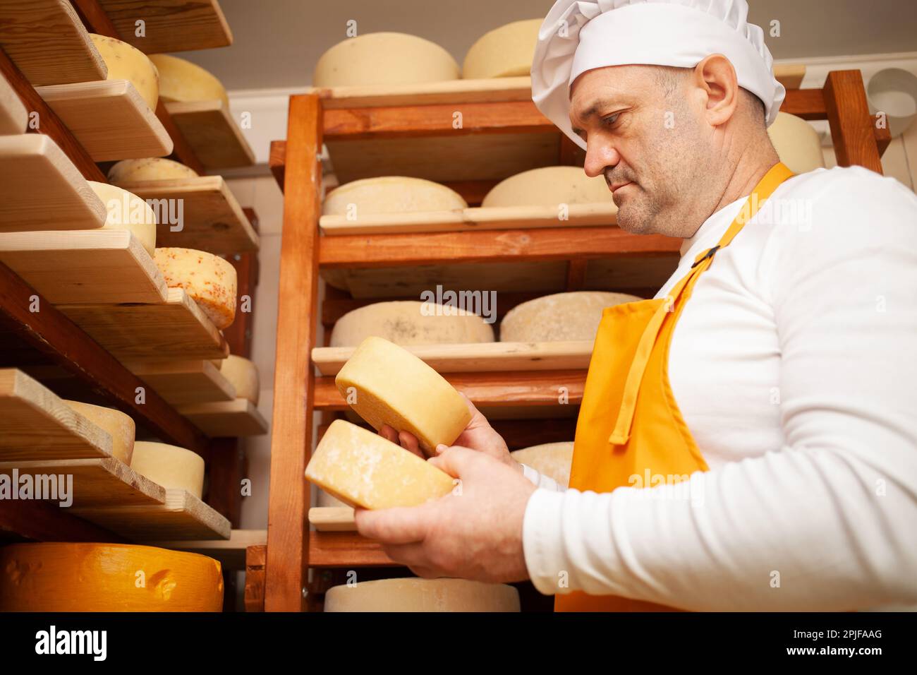 male, man cheese maker businessman, individual entrepreneur, checks ...