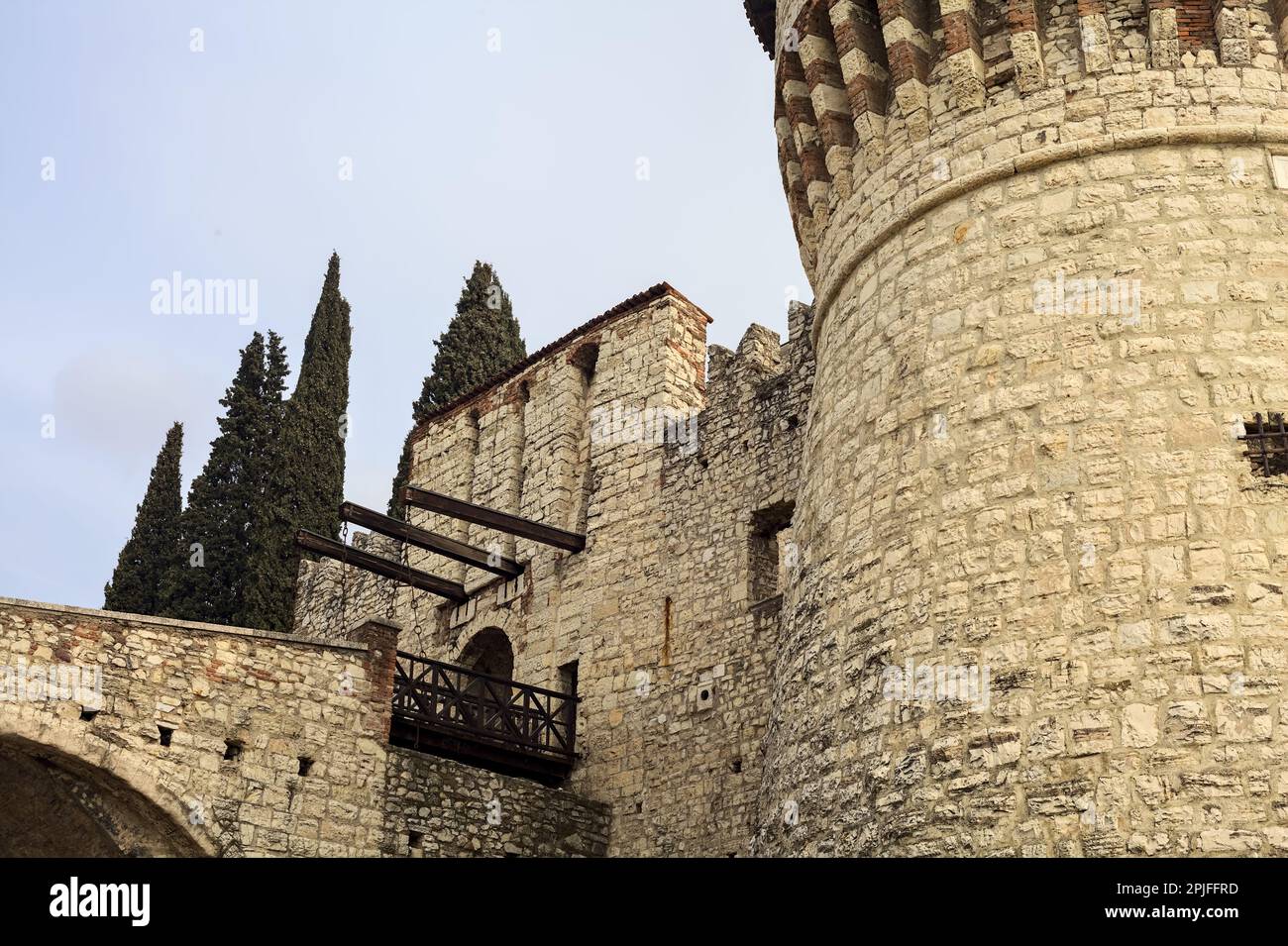 Stone bridge and the gate of a castle seen from the distance on a ...