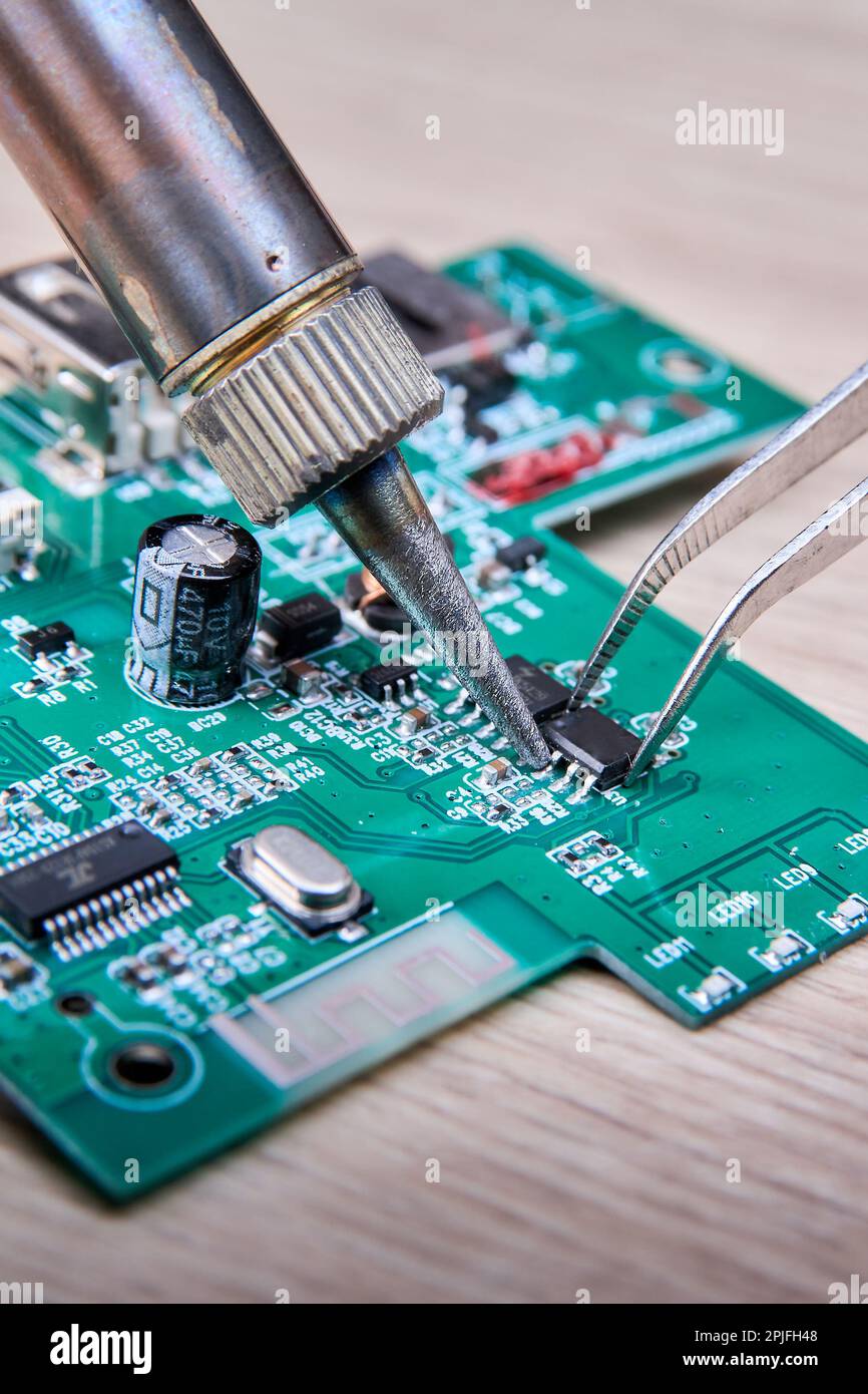 Repair of an electronic board by replacing a damaged part with a ...