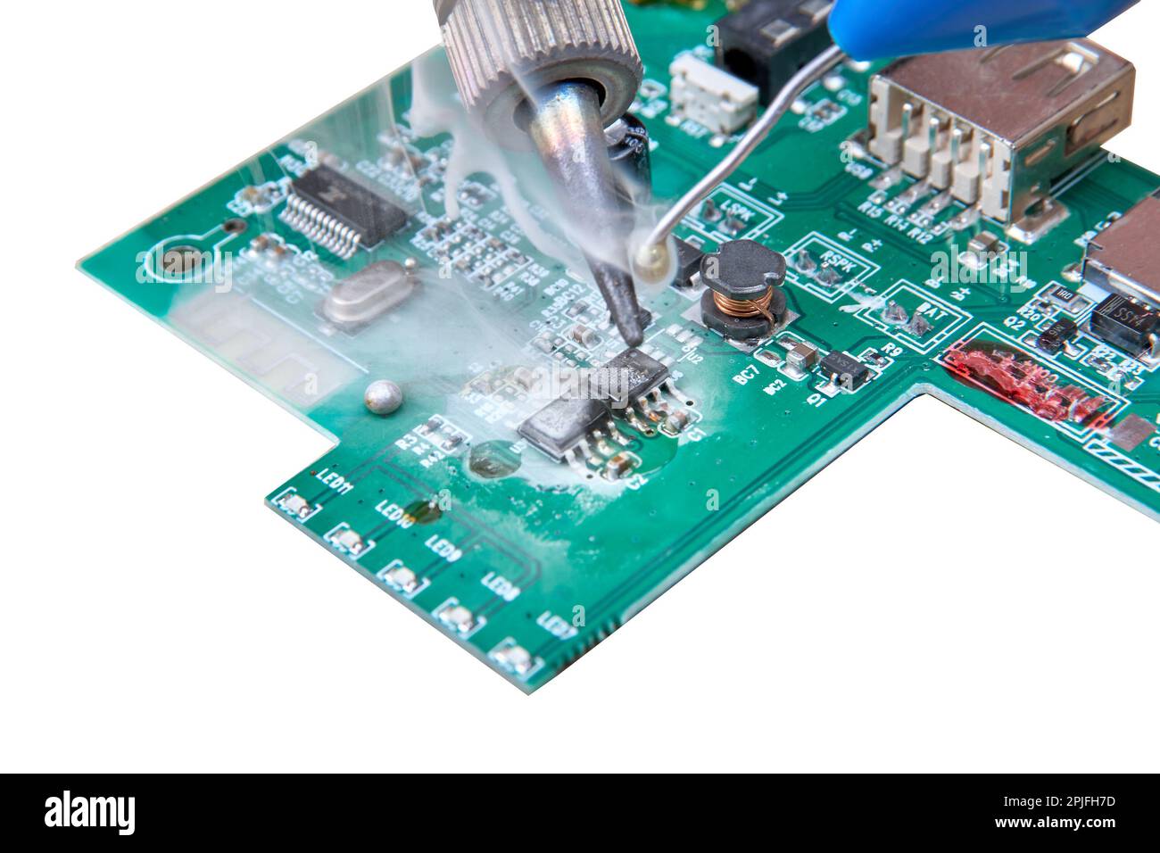 Repairing an electronic board with a soldering iron and tin wire Stock ...