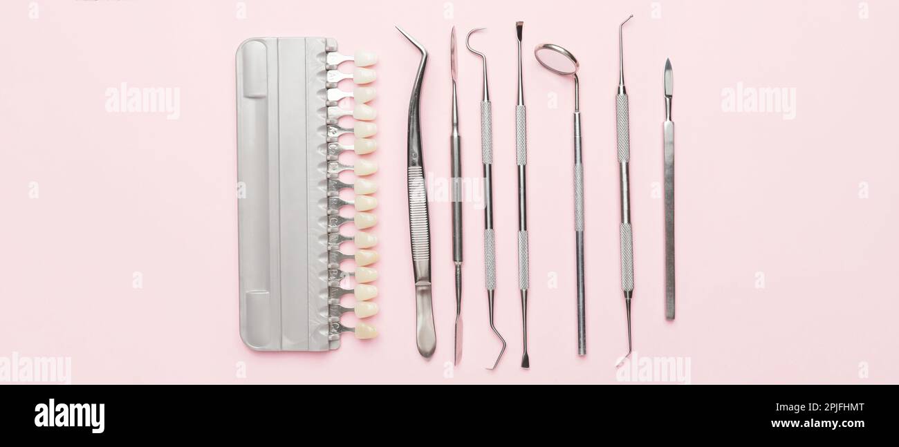 Dentist's tools and teeth color samples on light blue background Stock ...