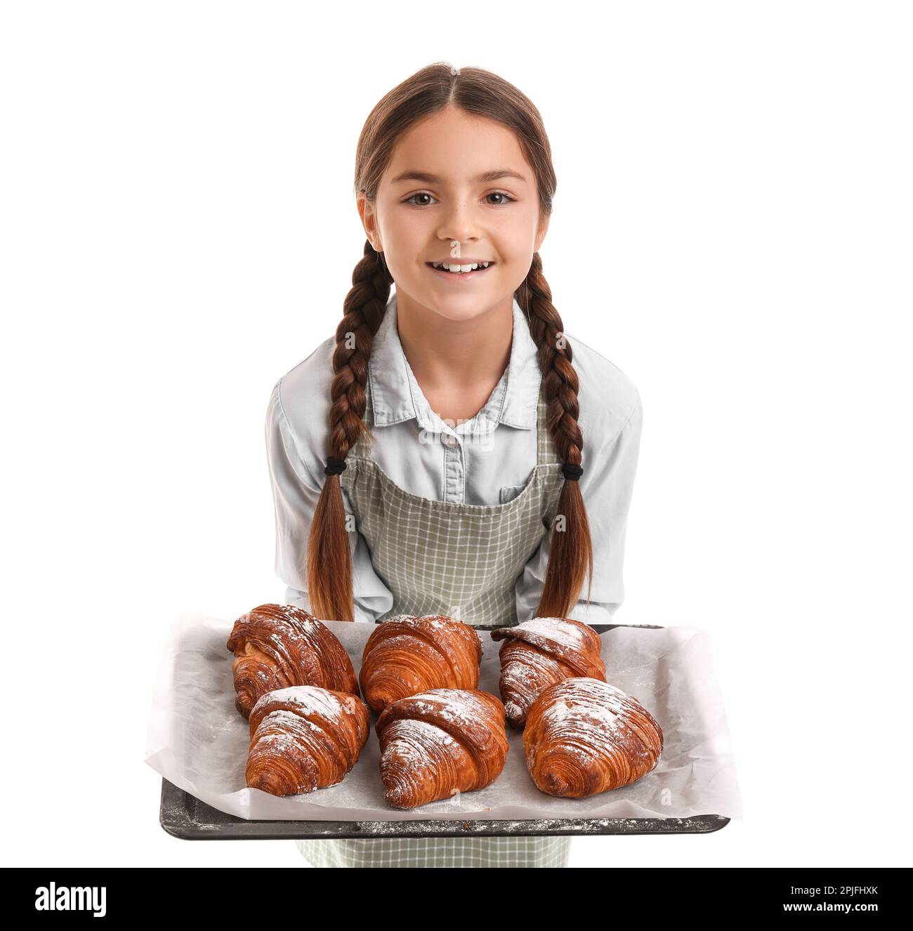 Little baker with tray of tasty croissants on white background Stock ...