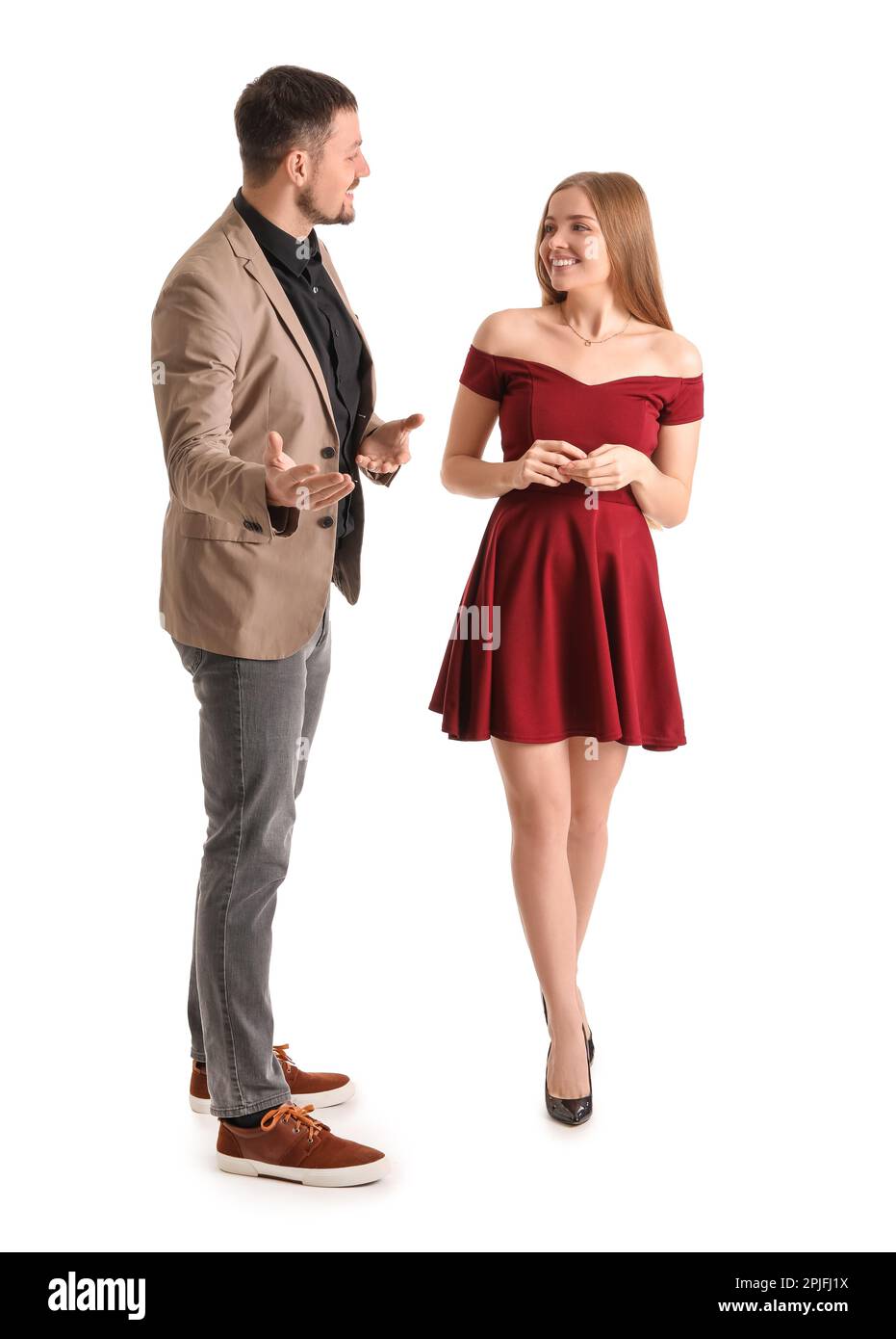 Young man letting his wife go first on white background Stock Photo - Alamy