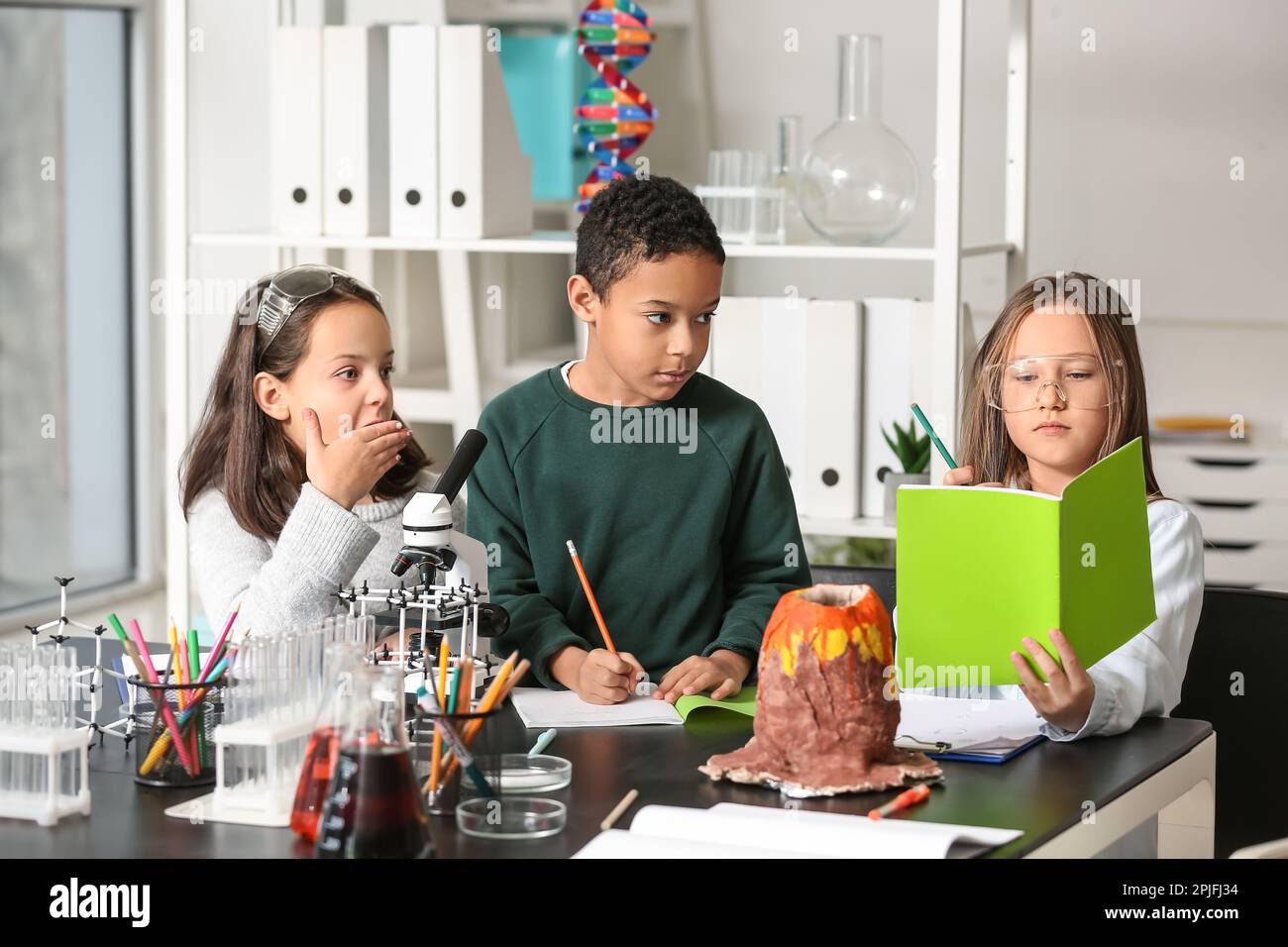 Little children studying Chemistry in science classroom Stock Photo - Alamy