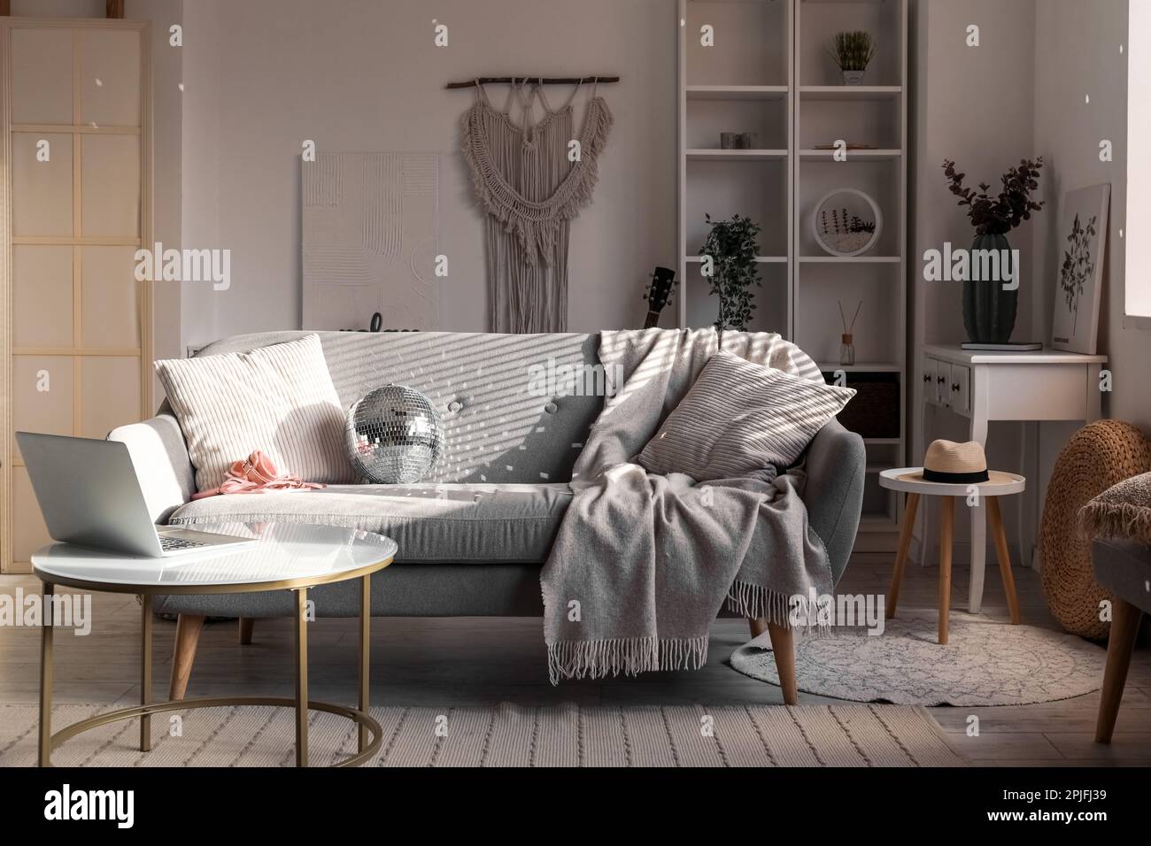 Interior of living room with disco ball and sofa Stock Photo - Alamy