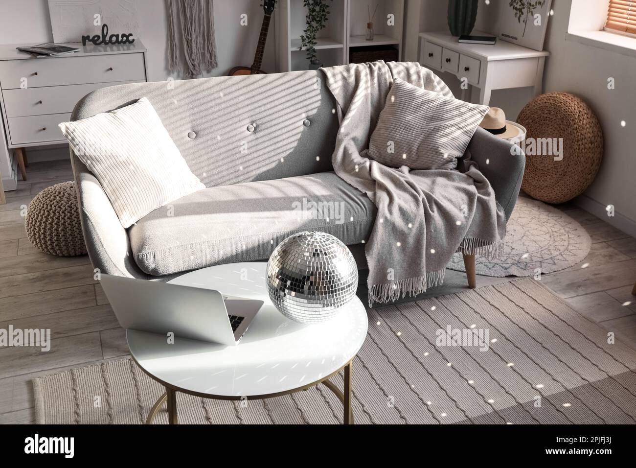 Interior of living room with disco ball and sofa Stock Photo - Alamy