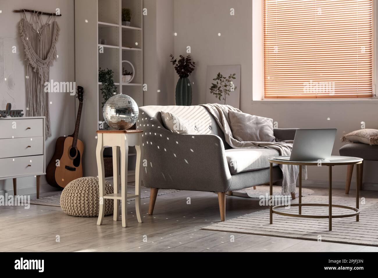 Interior of living room with disco ball and sofa Stock Photo - Alamy