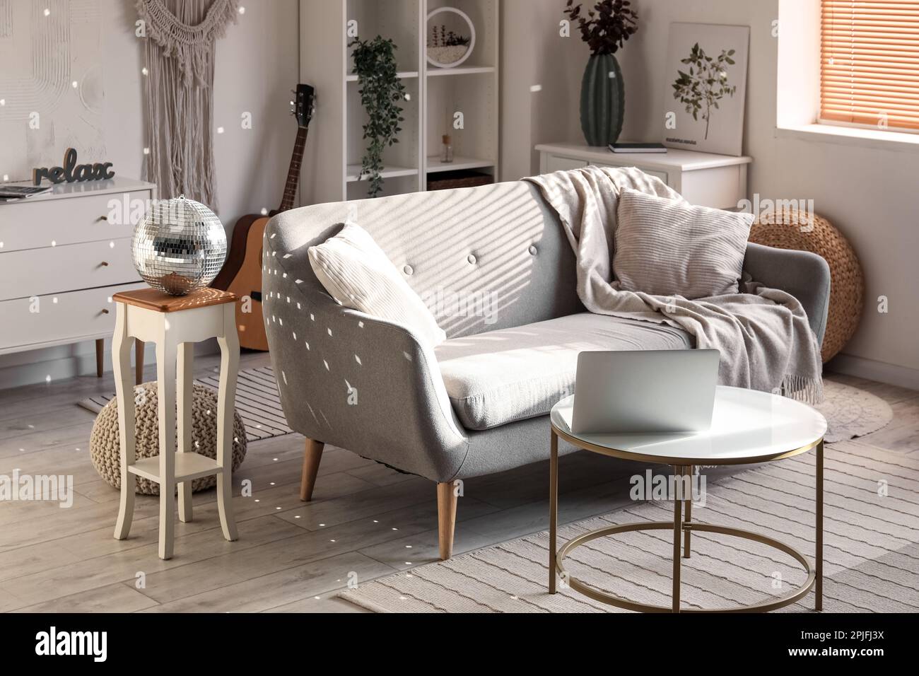 Interior of living room with disco ball and sofa Stock Photo - Alamy