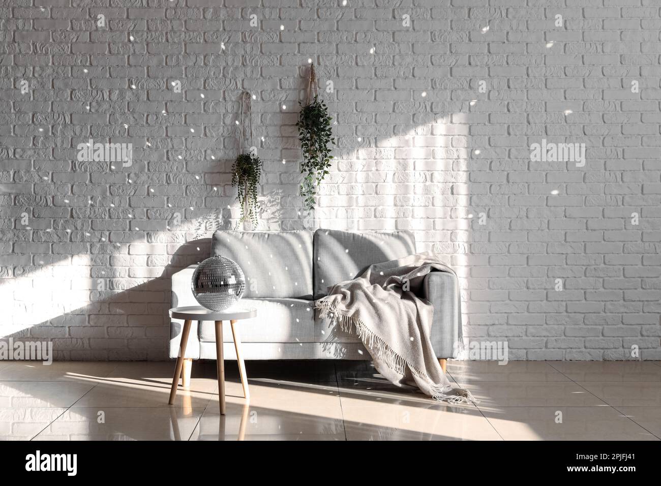 Interior of living room with disco ball and sofa Stock Photo - Alamy