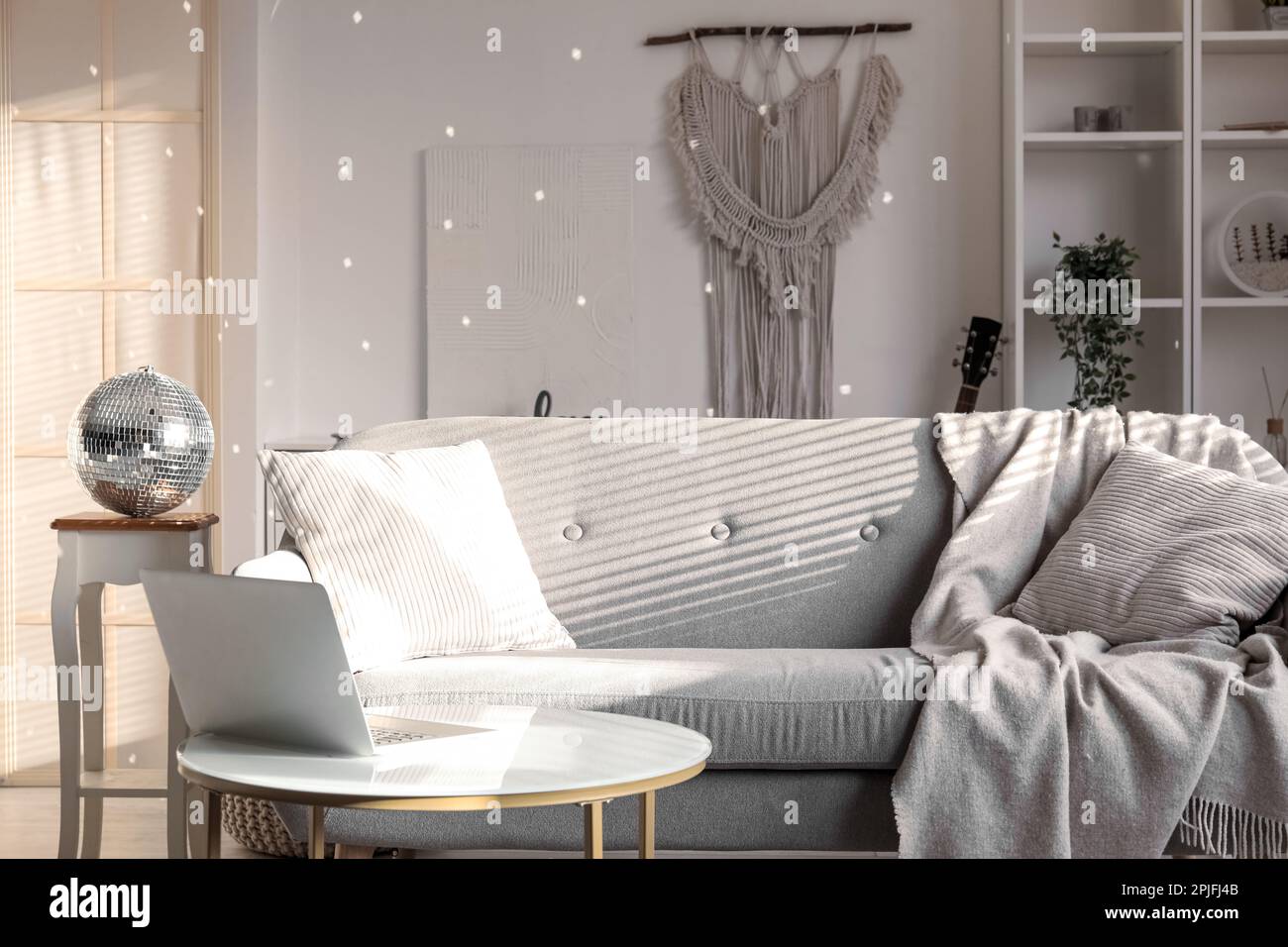 Interior of living room with disco ball and sofa Stock Photo - Alamy