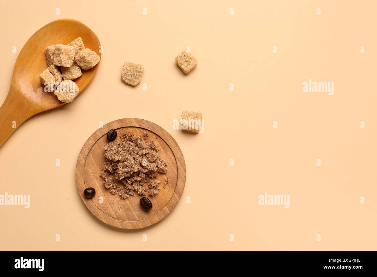 Wooden board with body scrub and cane sugar on color background Stock ...