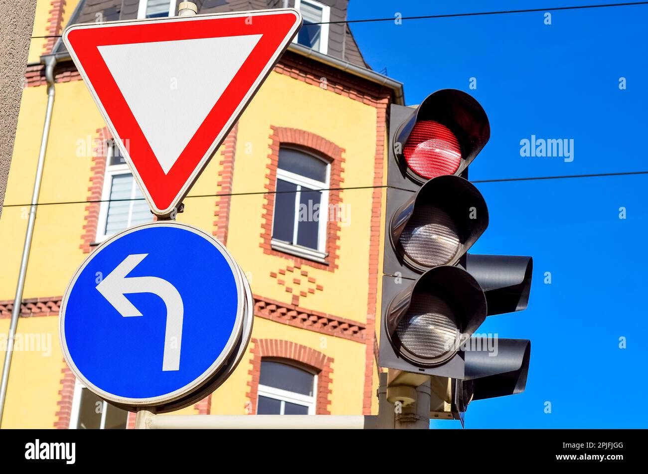 View of traffic lights with road signs in city, closeup Stock Photo - Alamy