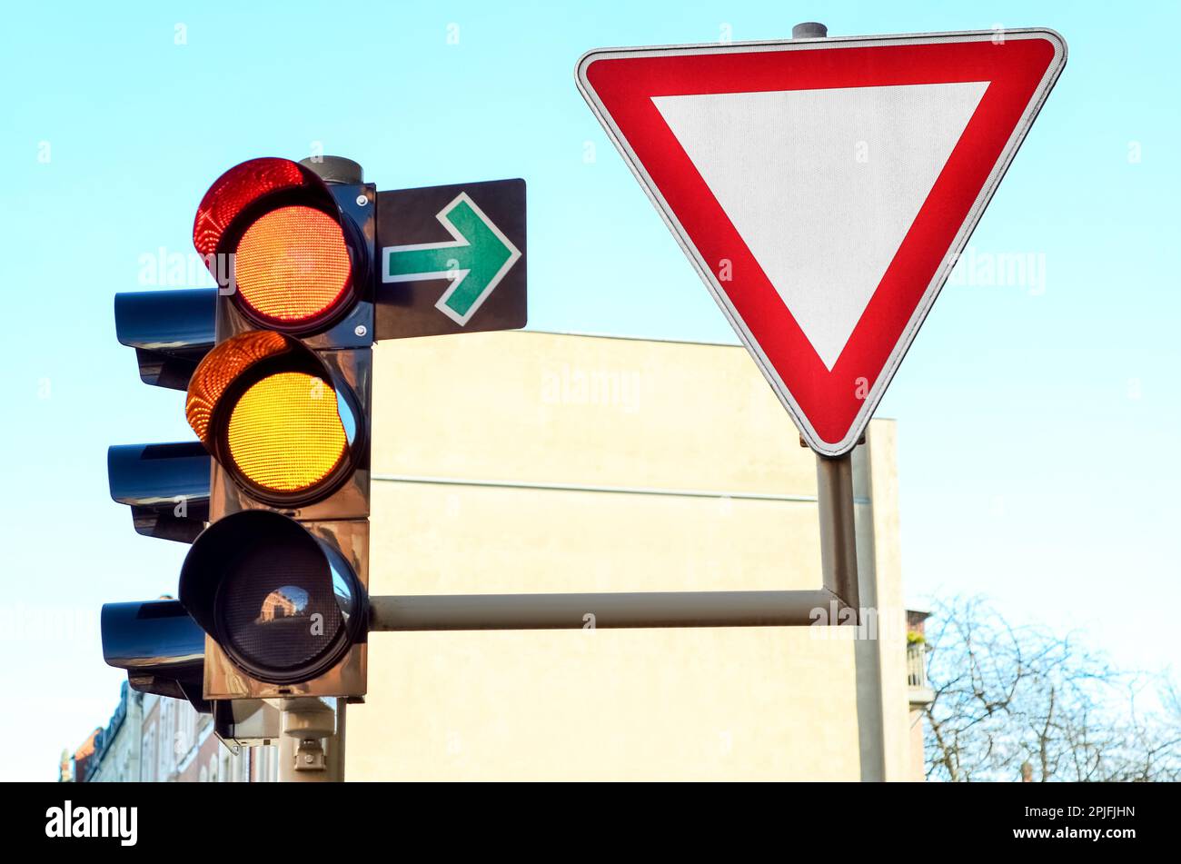 View of traffic lights with road signs in city, closeup Stock Photo - Alamy