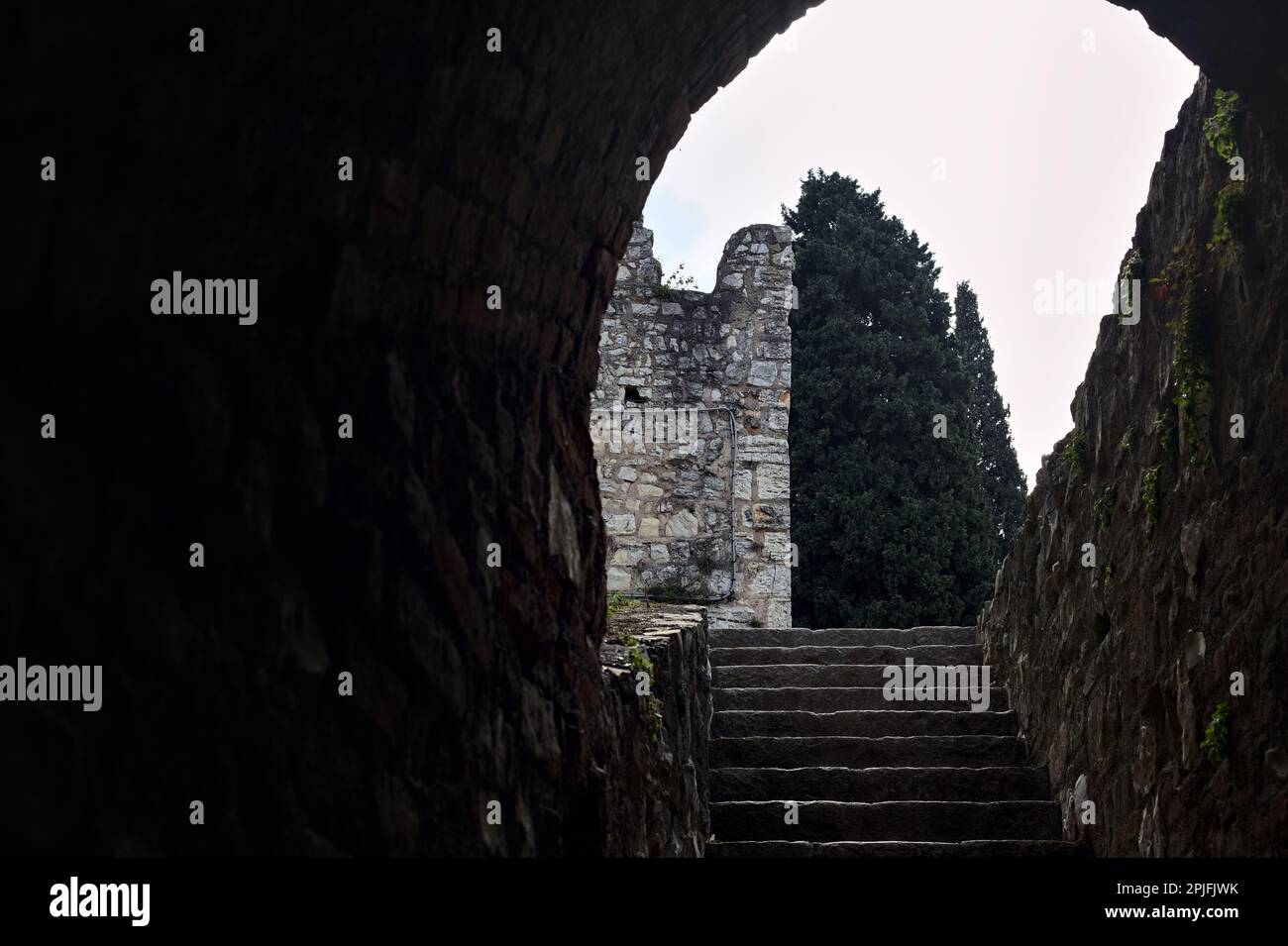 Staircase under a covered passage in a castle Stock Photo - Alamy