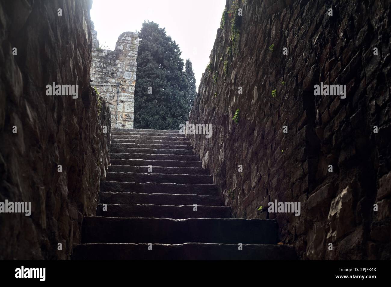 Staircase under a covered passage in a castle Stock Photo - Alamy