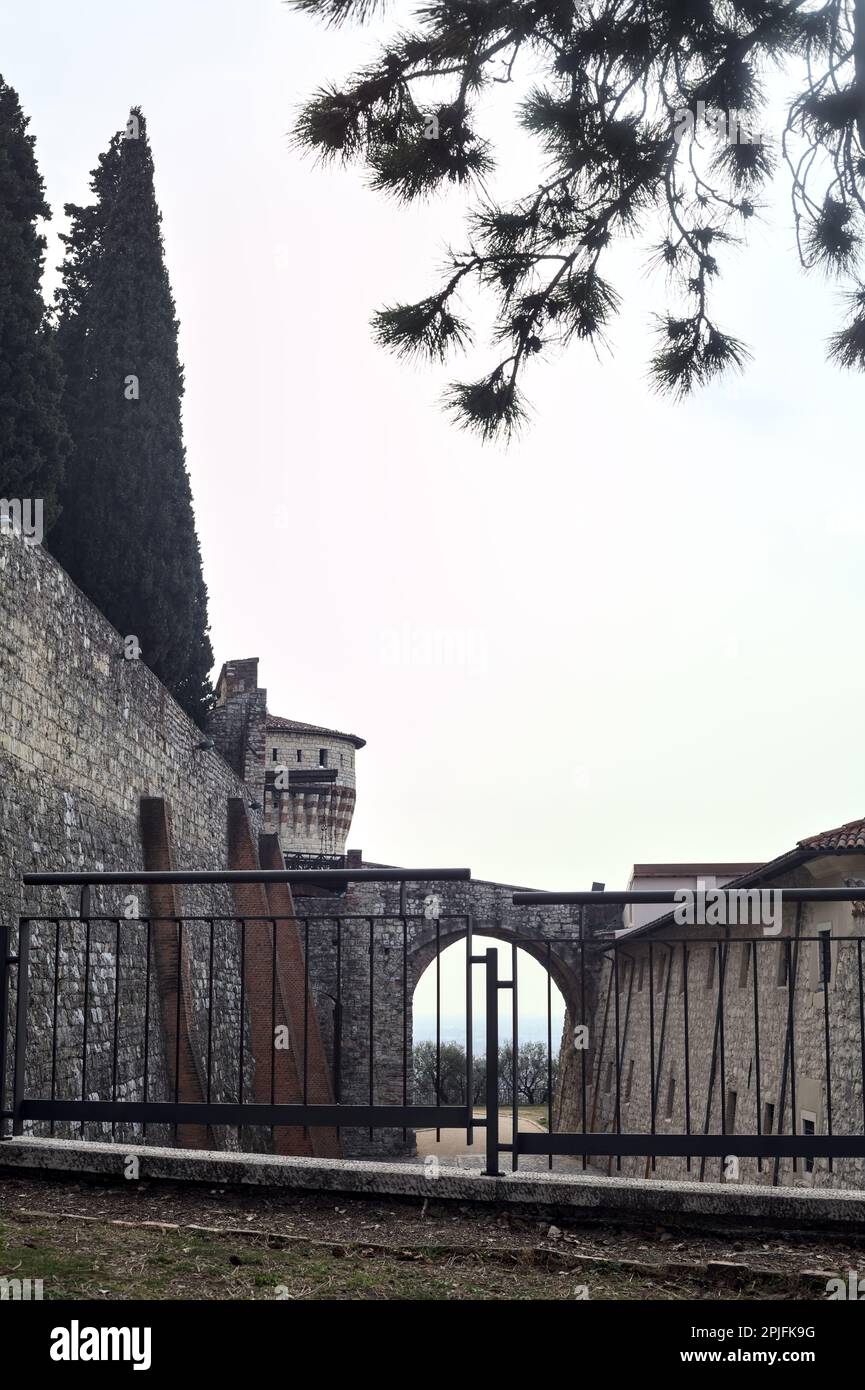 Stone bridge and the gate of a castle seen from the distance on a ...