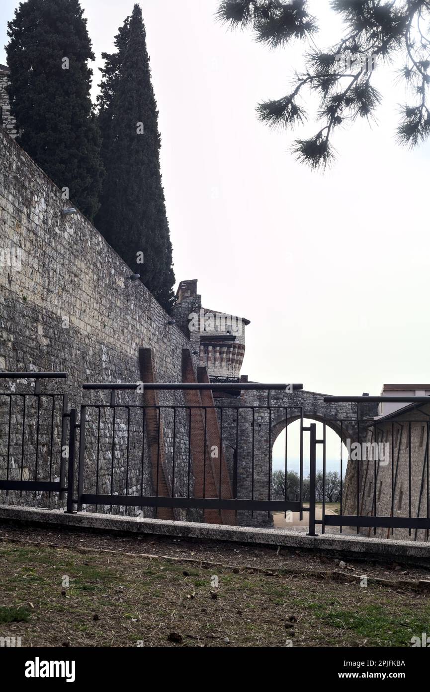 Stone bridge and the gate of a castle seen from the distance on a ...