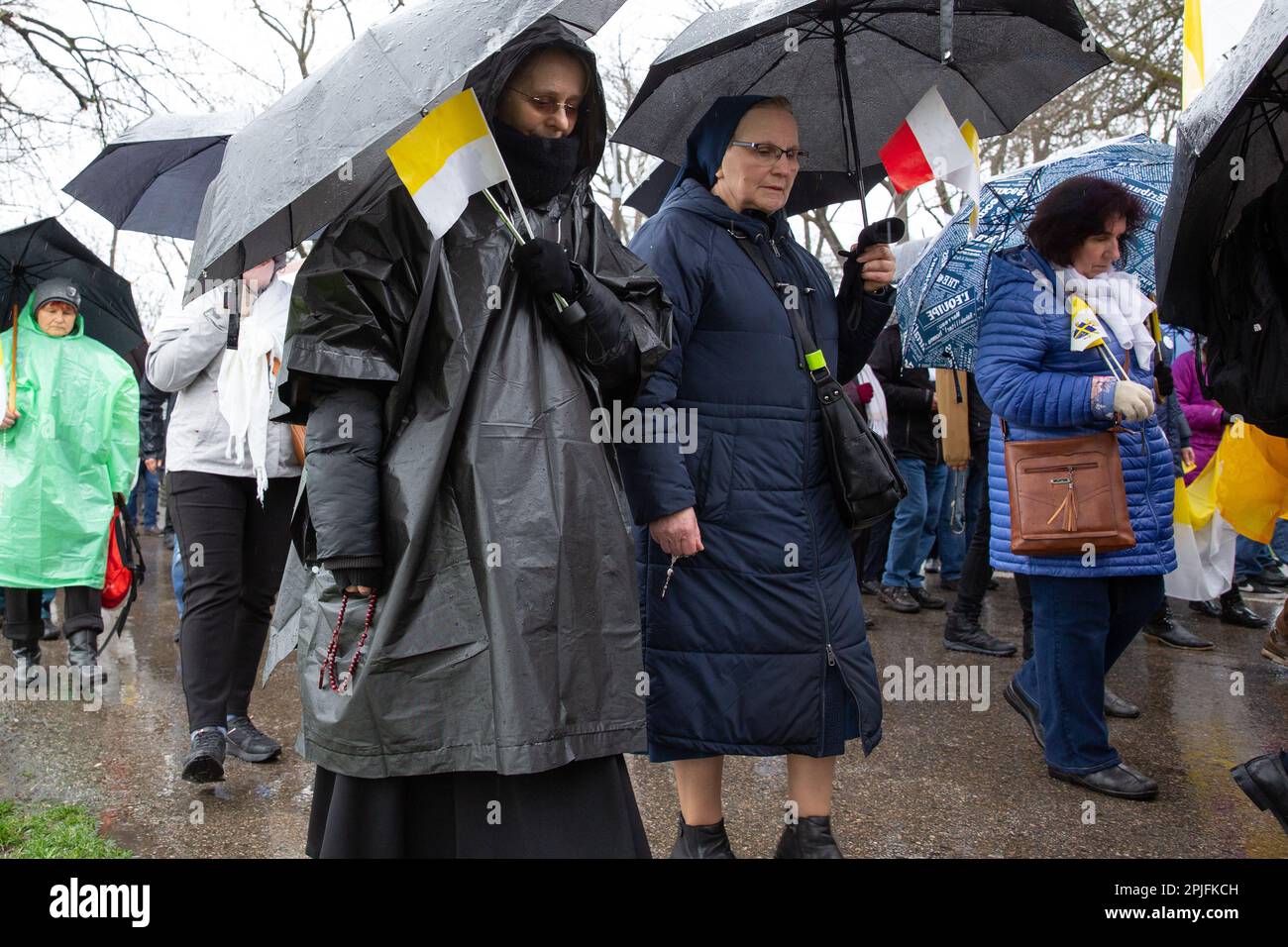 Nuns hold rosaries as thousands of people participate in a White Papal ...