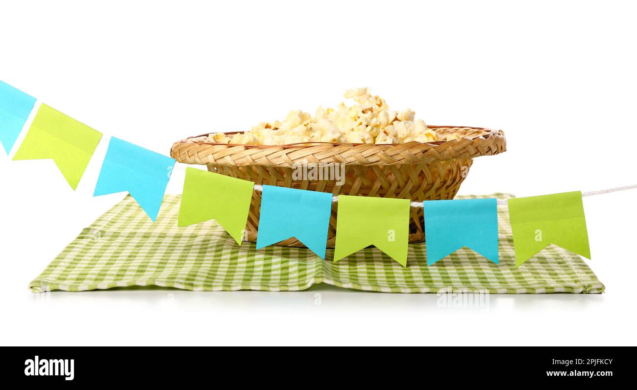 Straw hat with popcorn, napkin and paper flags on white background ...